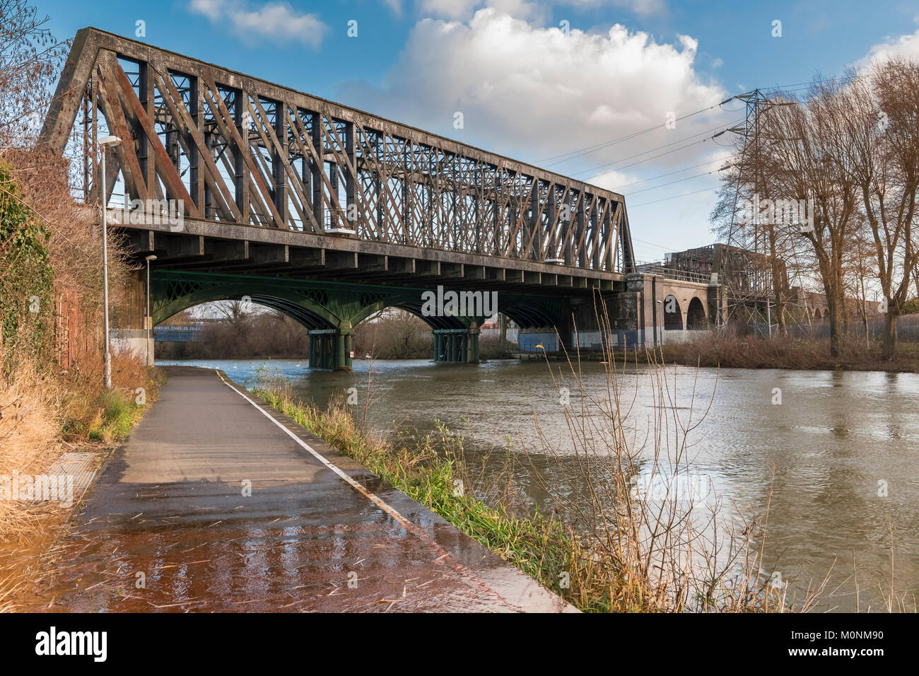 The 19th century cast iron railway bridge over the River Nene in ...