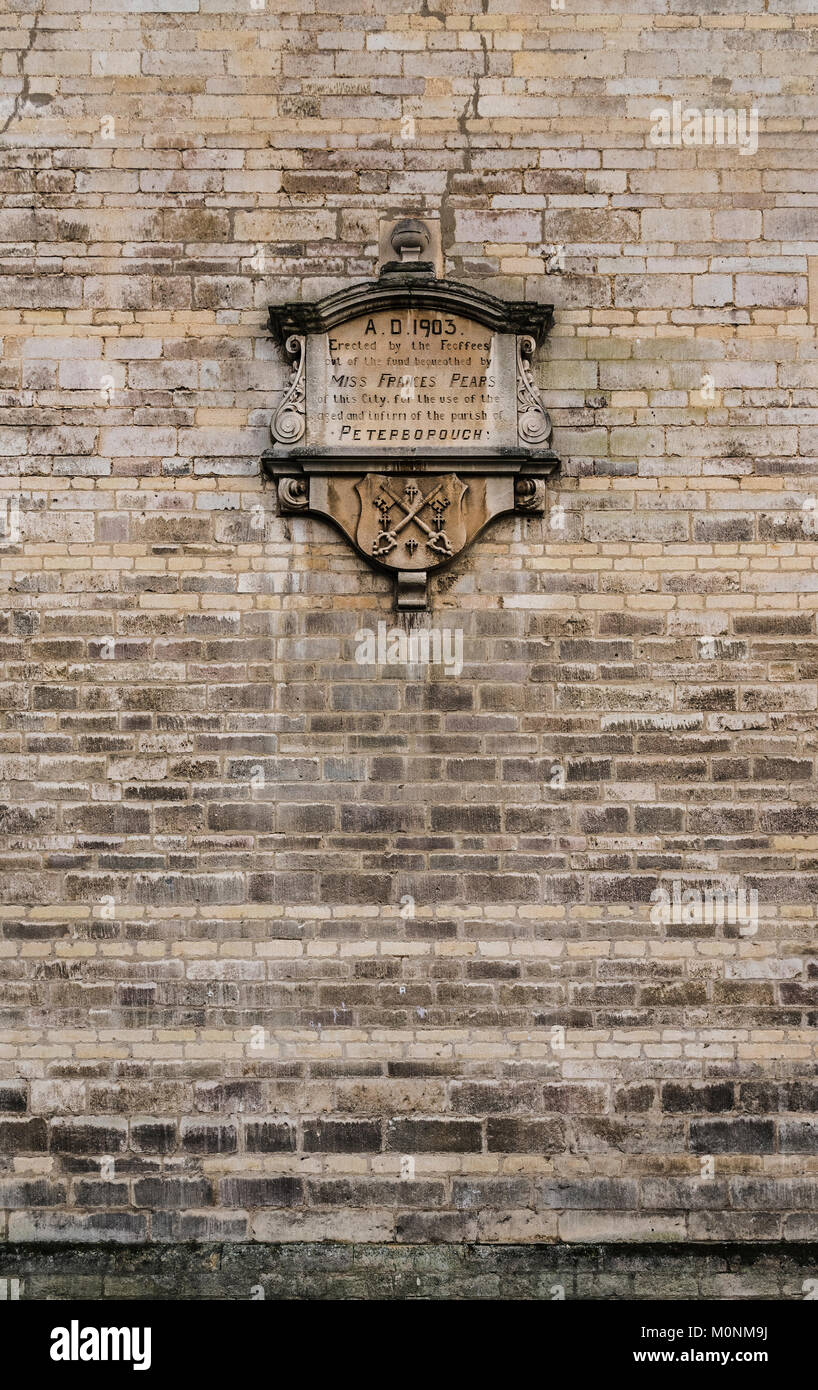 Detail of Jurassic limestone wall of building in Cumbergate, central ...