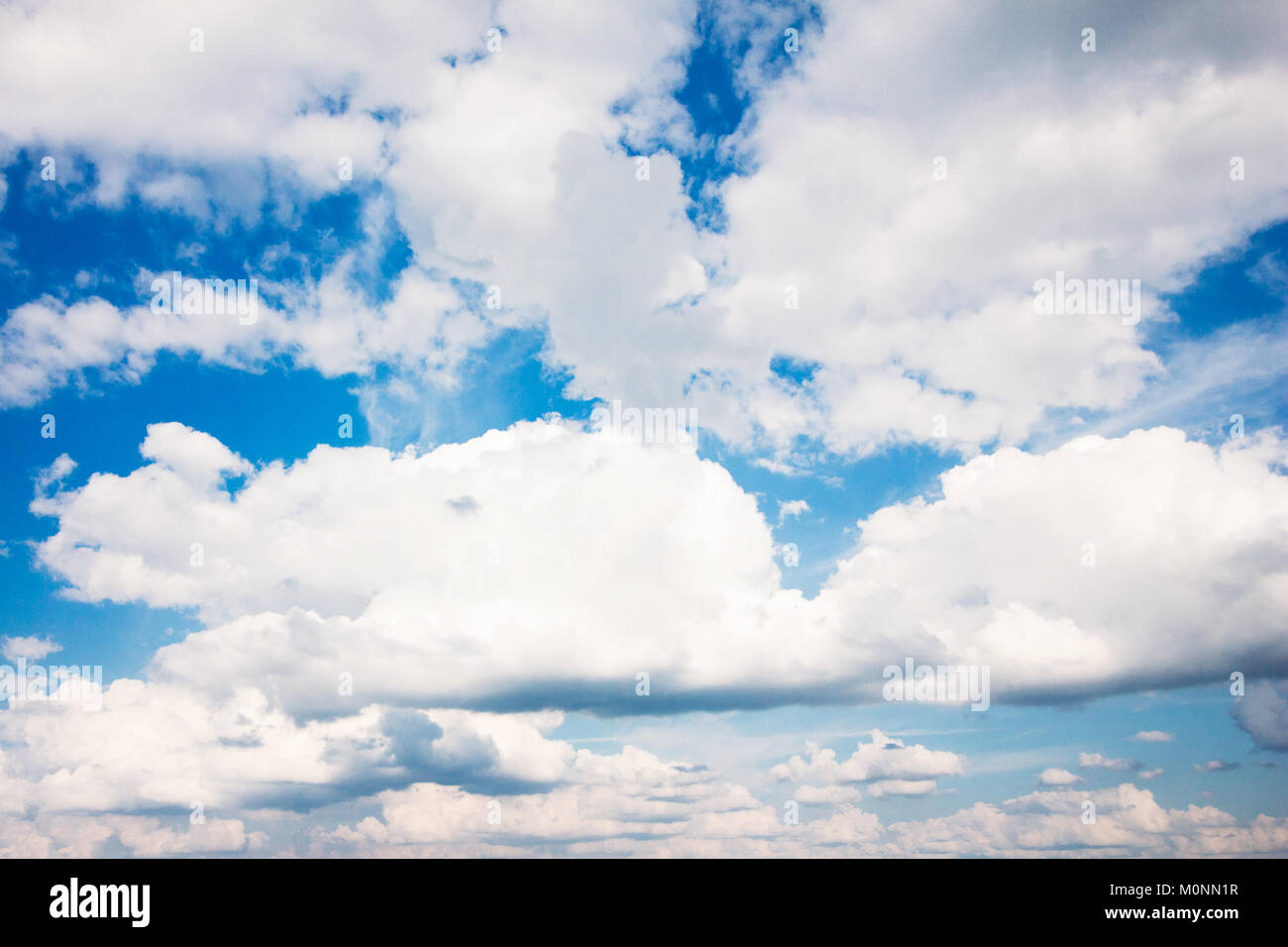 Bright beautiful blue sky with clouds. Nature Stock Photo - Alamy