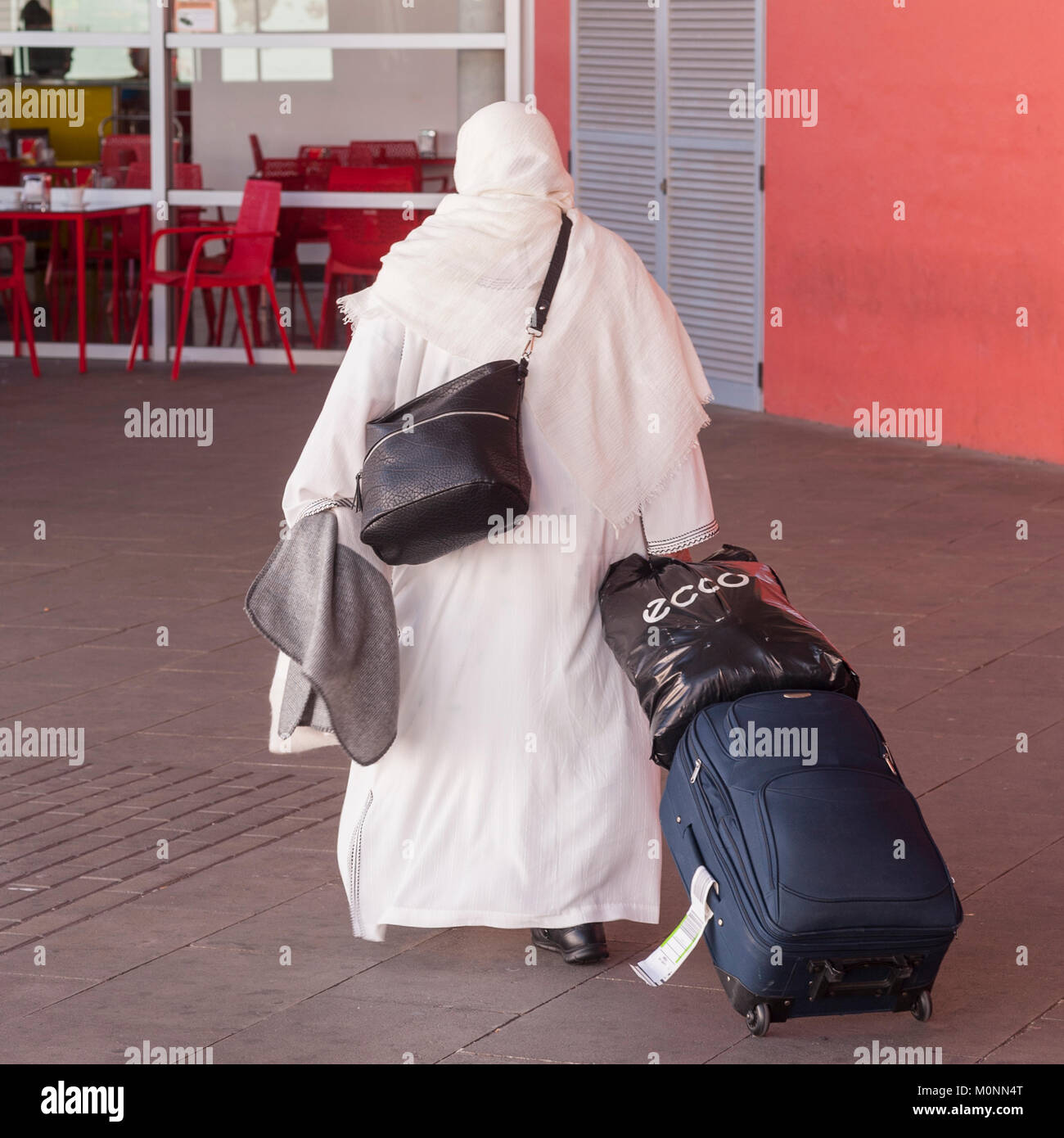 People waiting for a bus at the bus station in Mahon , Menorca ...