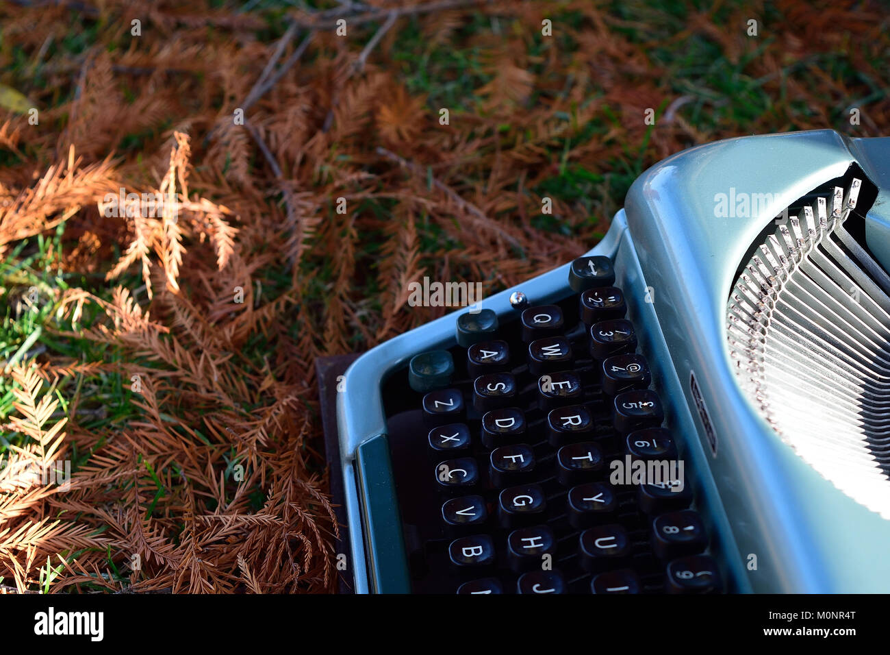 Close-up of a corner of an old typewriter taken outdoors against ...