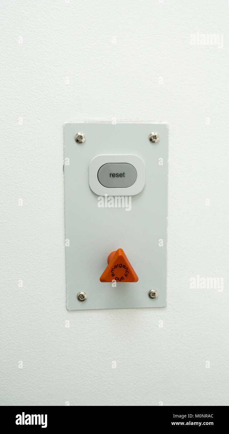 Emergency pull button in toilet Stock Photo - Alamy