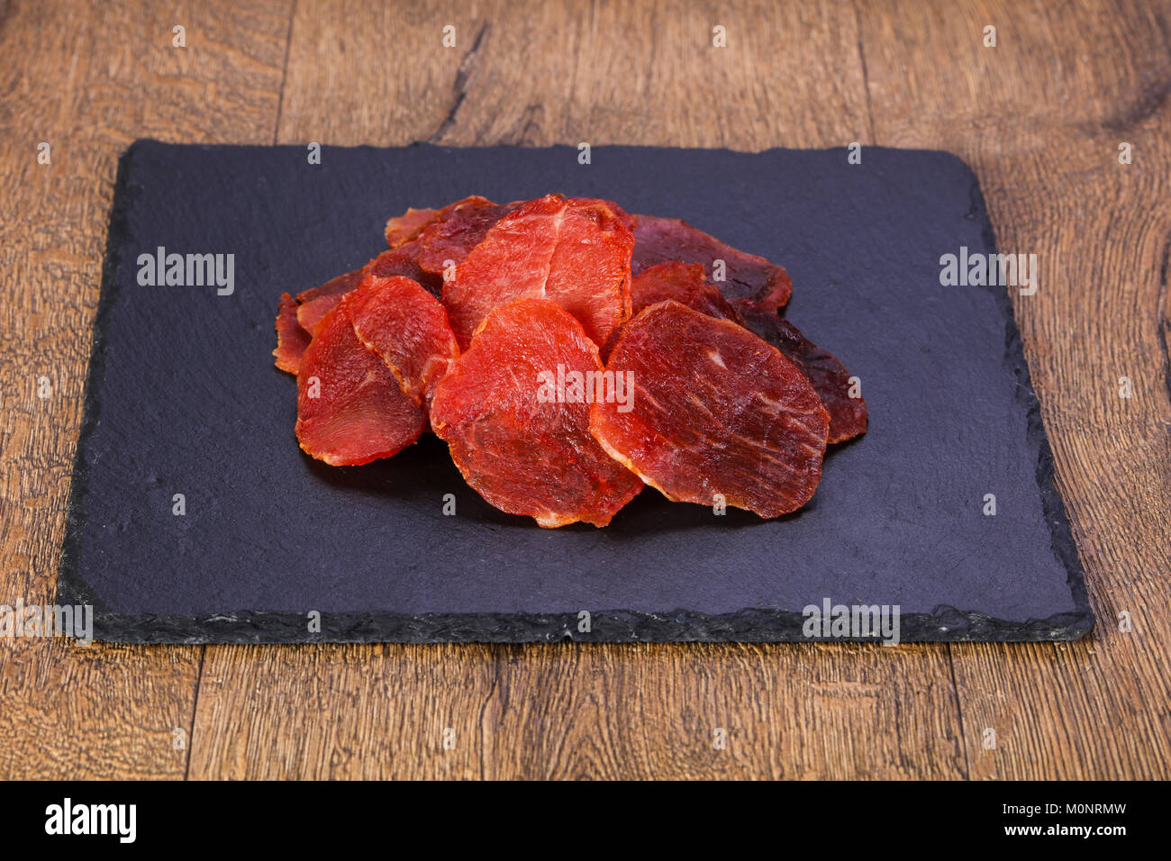 Dry pork meat heap over wooden Stock Photo - Alamy