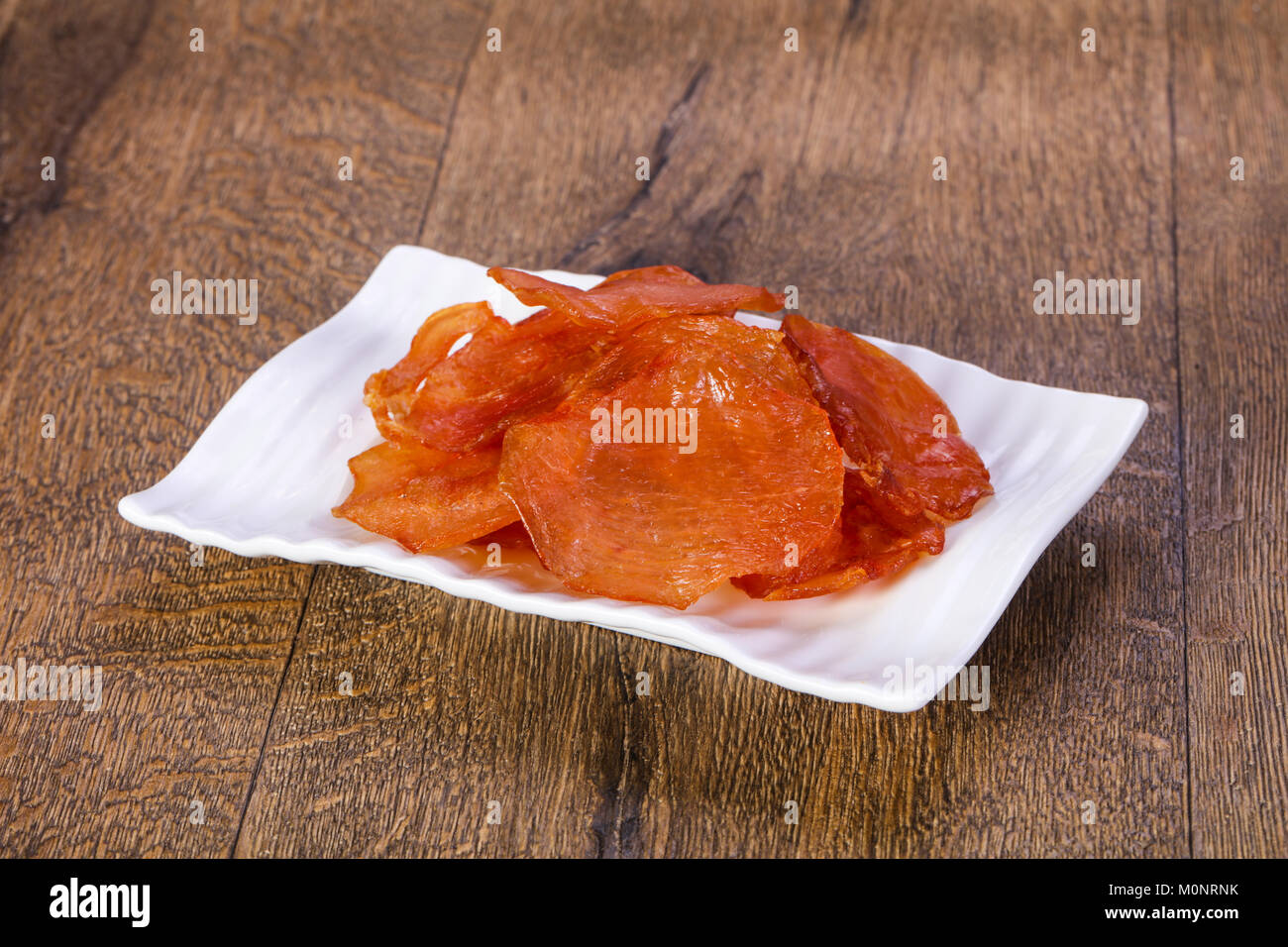 Dry chicken meat over wooden Stock Photo - Alamy