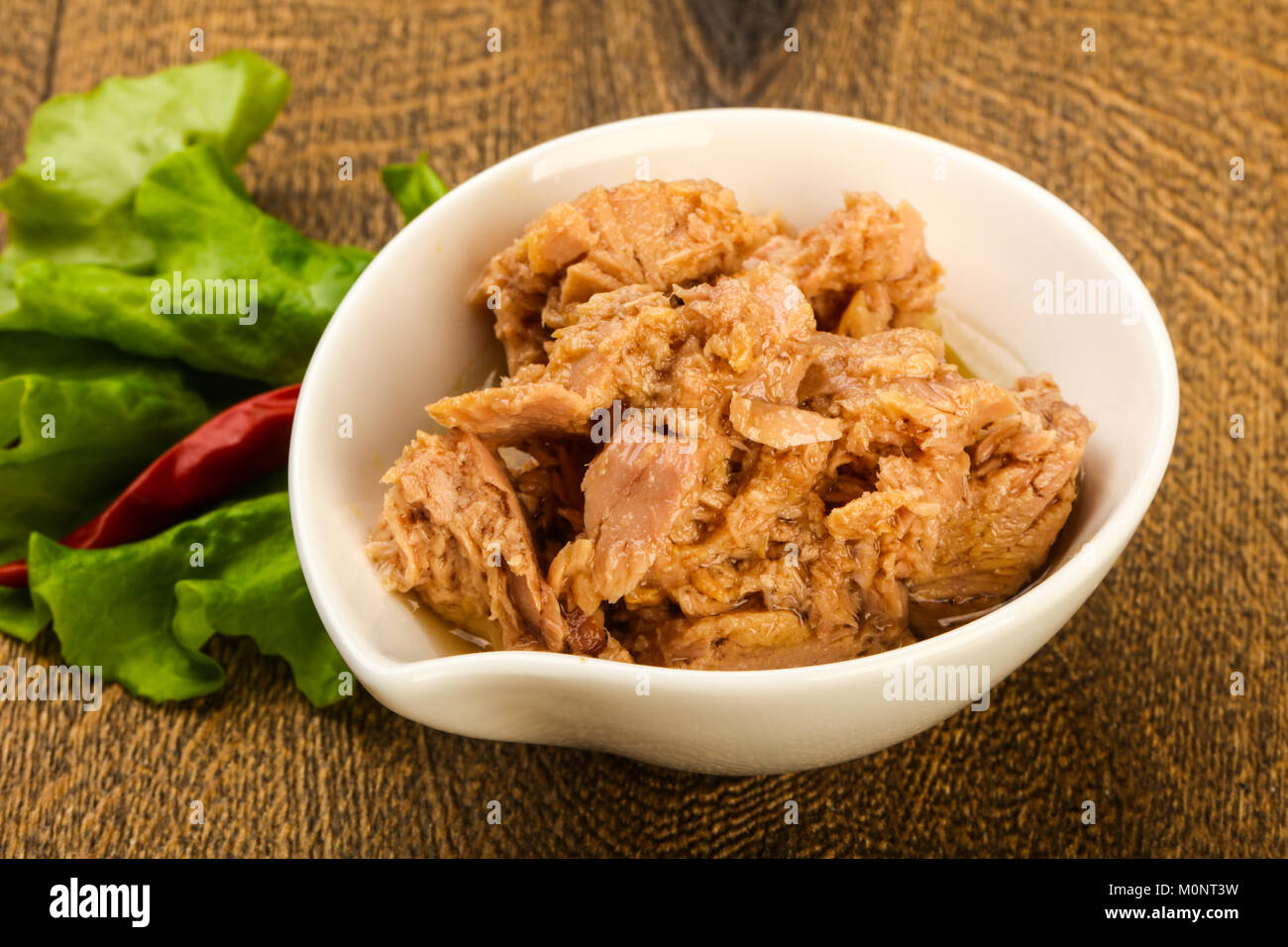 Canned tuna fish in the bowl ready for cooking Stock Photo - Alamy