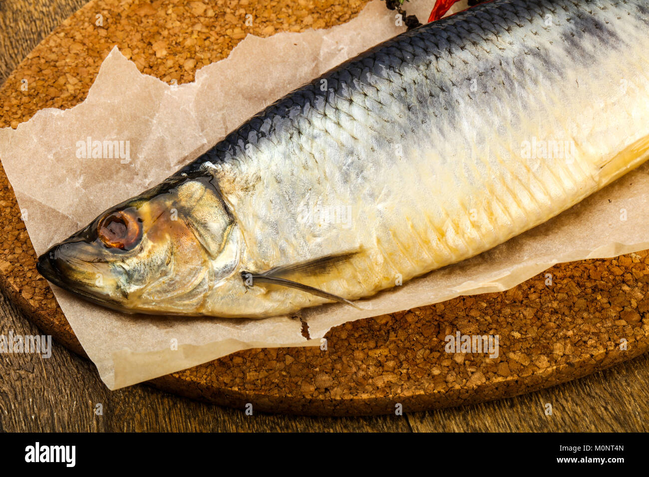 Salted Herring fish with pepper and spices Stock Photo - Alamy