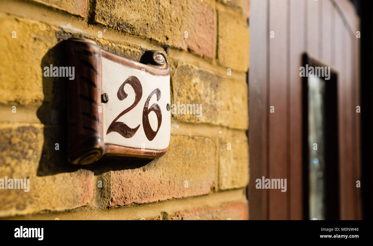 House number on wall Stock Photo - Alamy