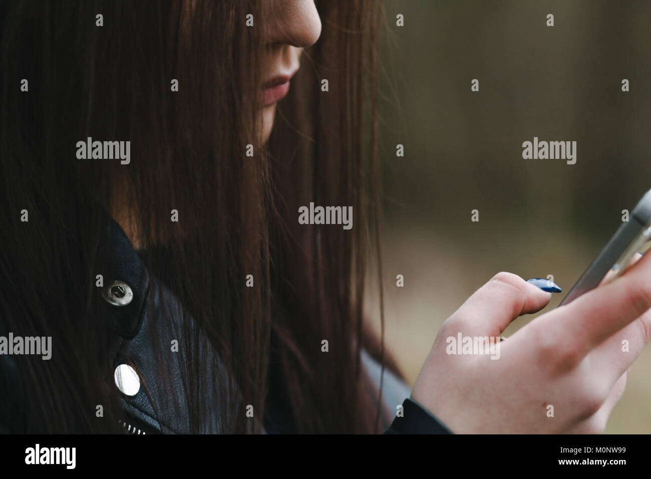 Anonymous teenager texting hi-res stock photography and images - Alamy