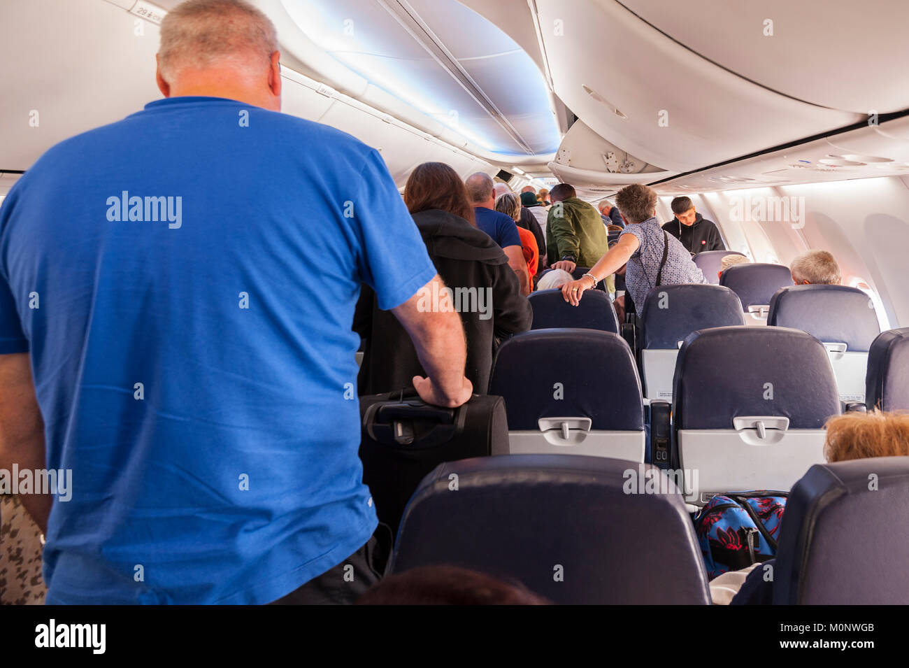 People leaving a plane Stock Photo - Alamy