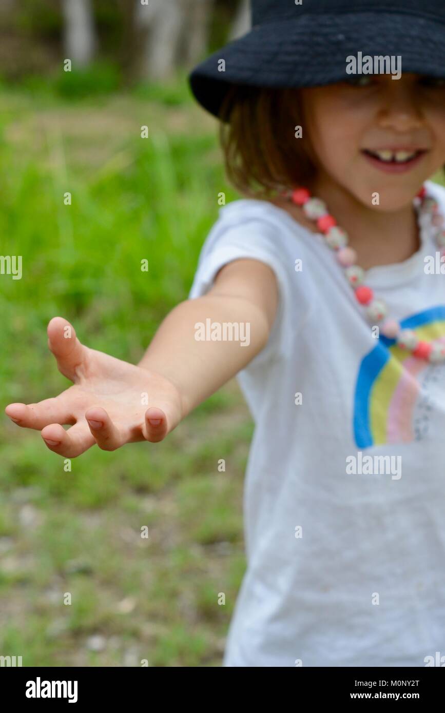 Girl holding out hand with invisible object, Herveys Range Heritage Tea ...