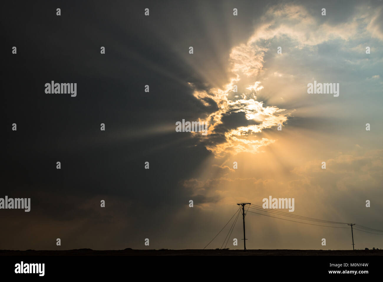 Obscured by the cloudy sky, the sunlight forms incredible trails of ...