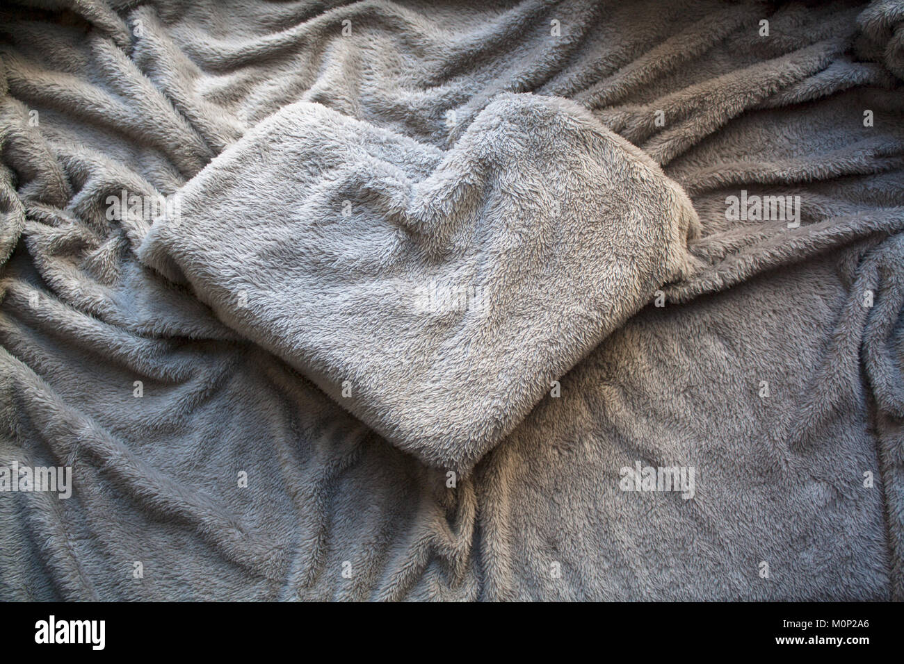 Fluffy beige textile heart shaped silhouette Stock Photo - Alamy