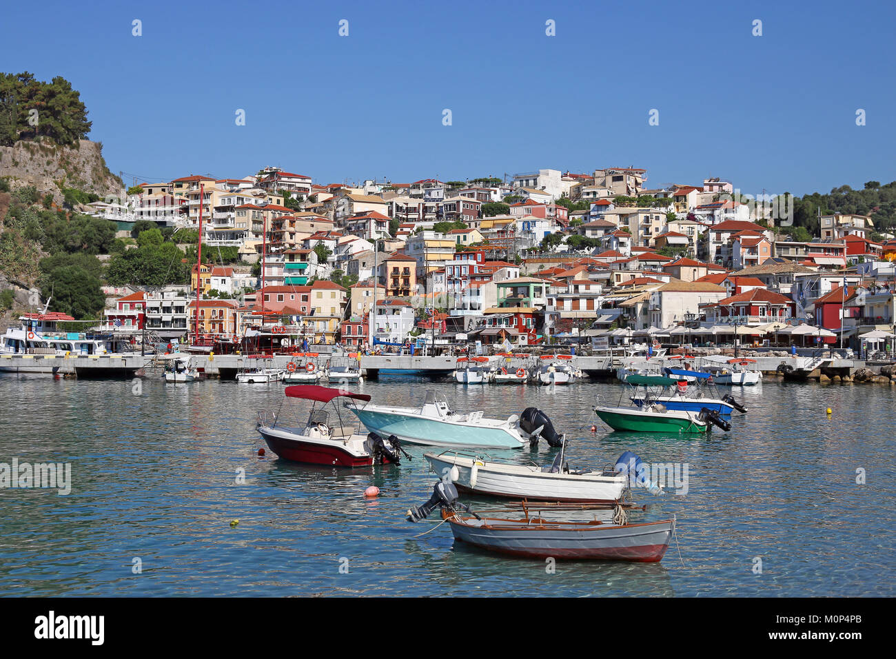 boats in port and colorful buildings Parga Greece Stock Photo - Alamy