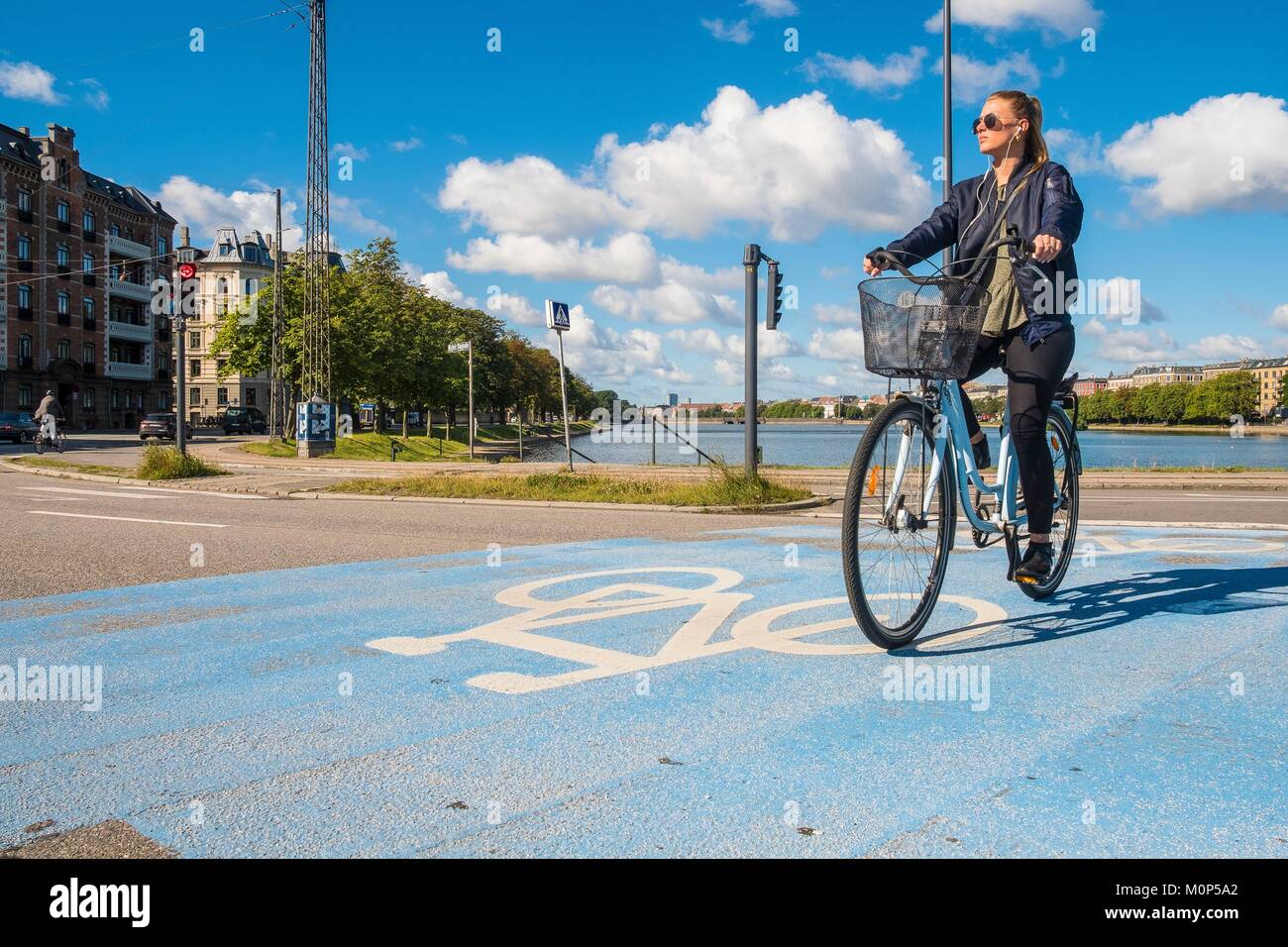 Denmark,Zealand,Copenhagen,Nørreport district,cycling on a bicycle path ...