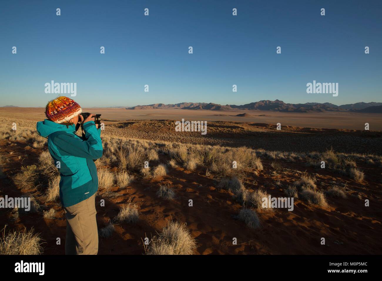 Namibia,Damaraland,photographer in winter in the Namib desert Stock ...