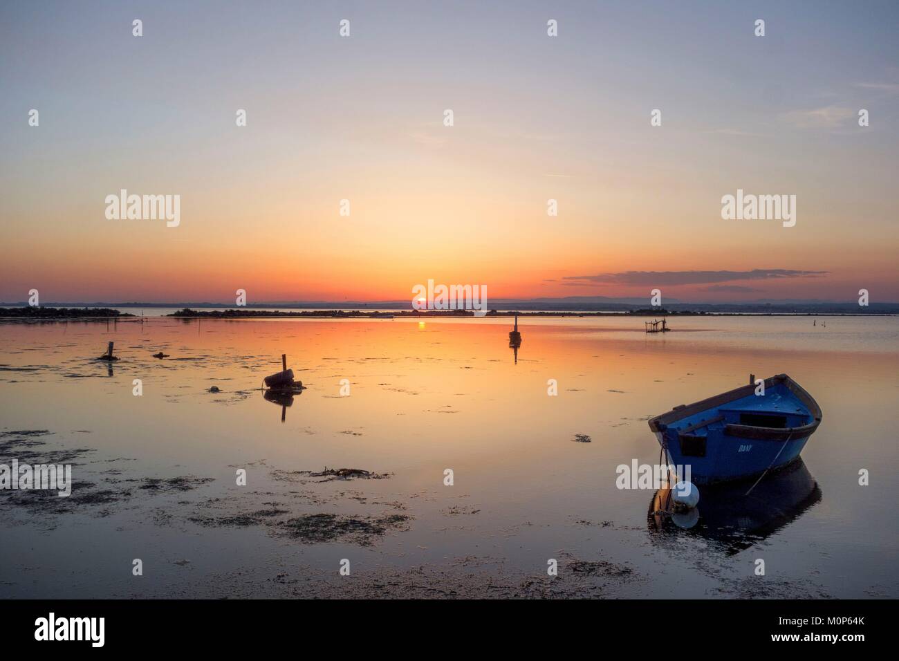 France,Herault,Sete,lagoon of Thau,sunset with a boat in the foreground ...