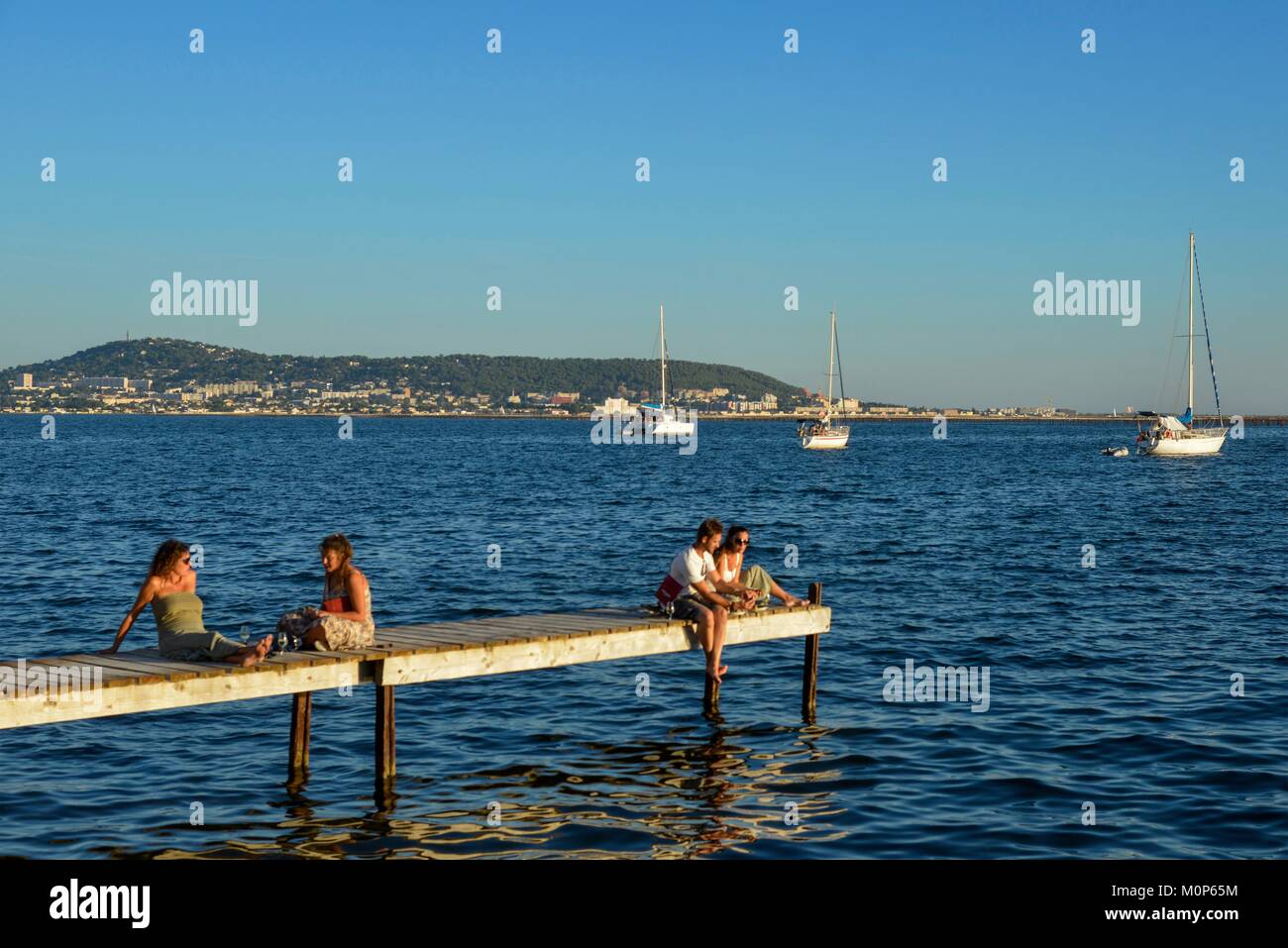 France,Herault,Bouzigues,lagoon of Thau,vacationers on a pontoon at ...