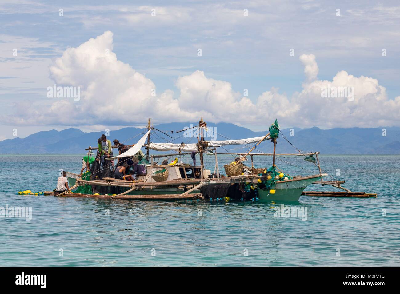 Philippines,Palawan,Roxas,Johnson Island,fishermen pulling a ring net ...