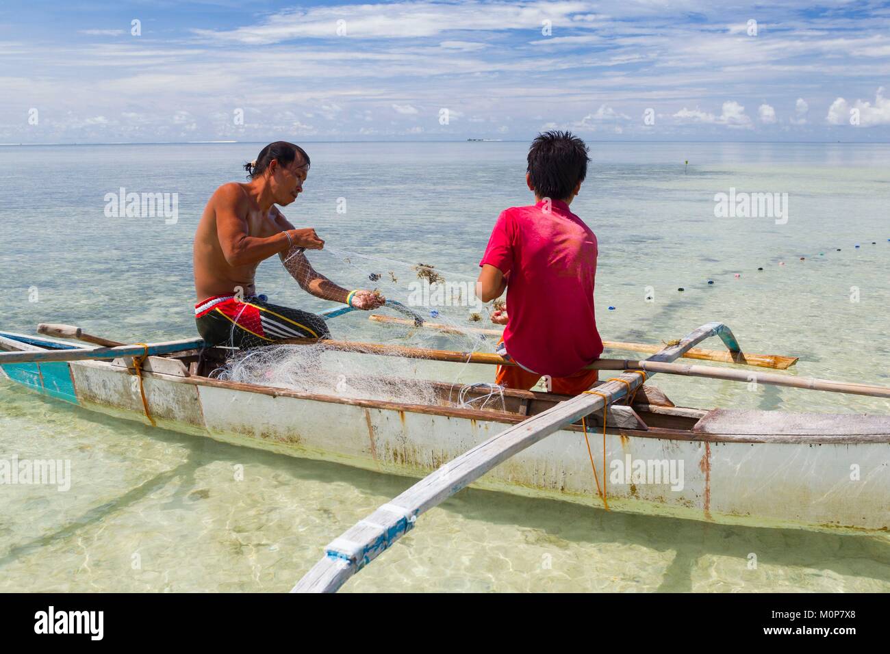 Philippines,Palawan,Roxas,Green Island Bay,Purao Island,father and son ...