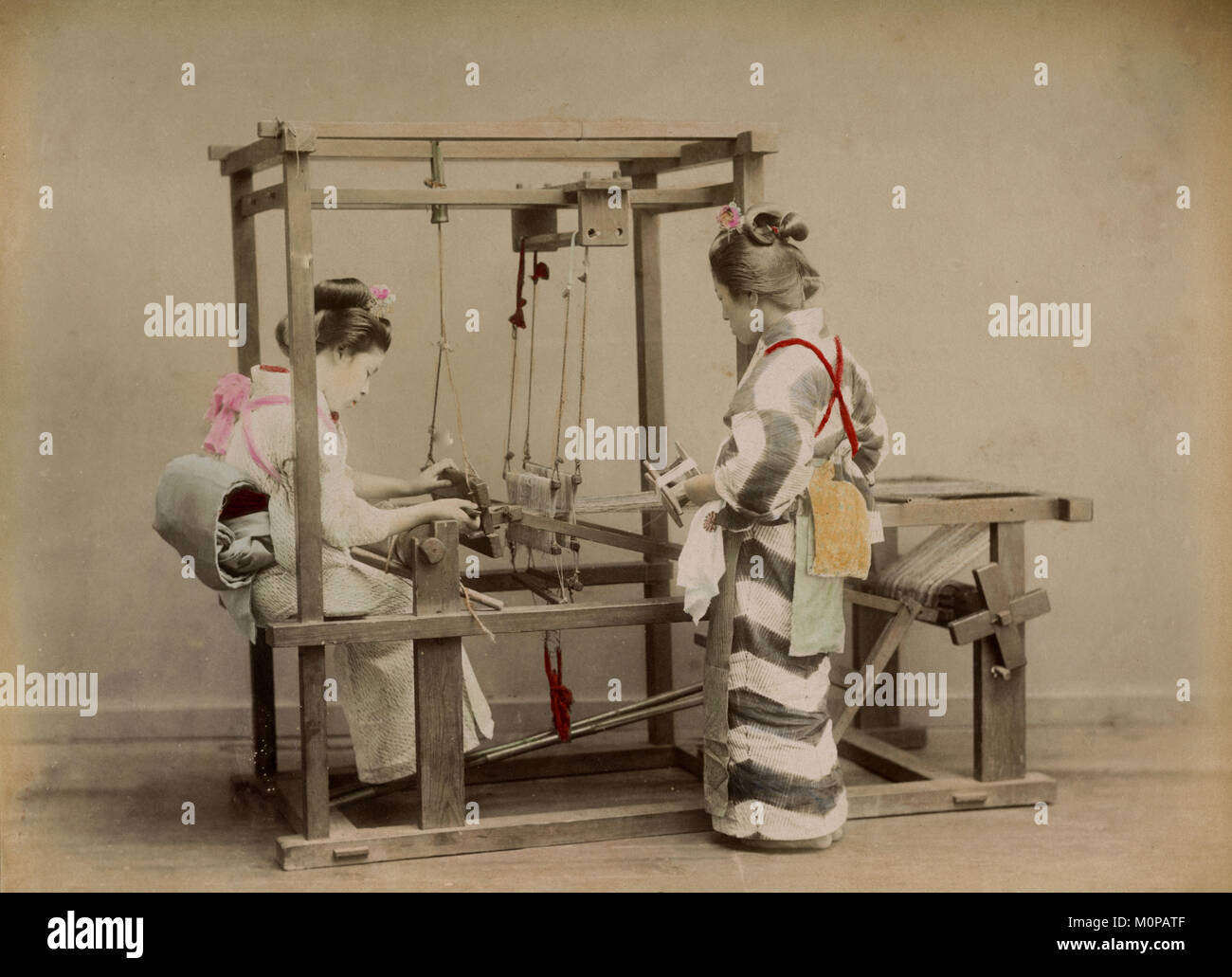 c. 1880s Japan - weaving on a loom Stock Photo - Alamy