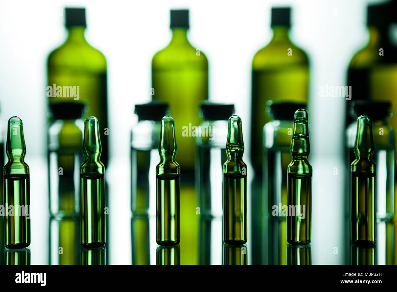 Group of ampoules with a transparent medicine in medical laboratory ...