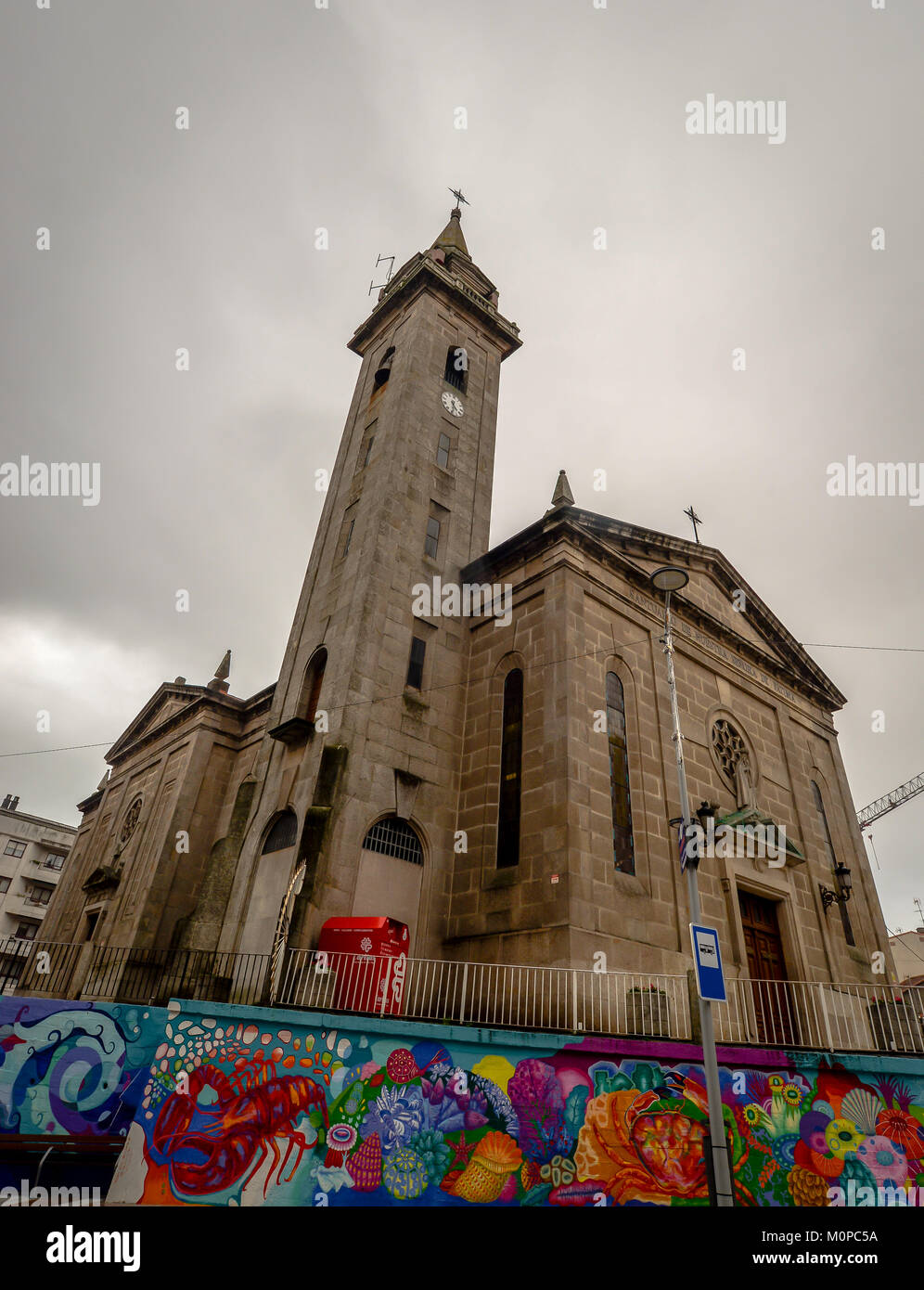A church in Vigo with a colourful wall in front of it - Vigo - Spain ...