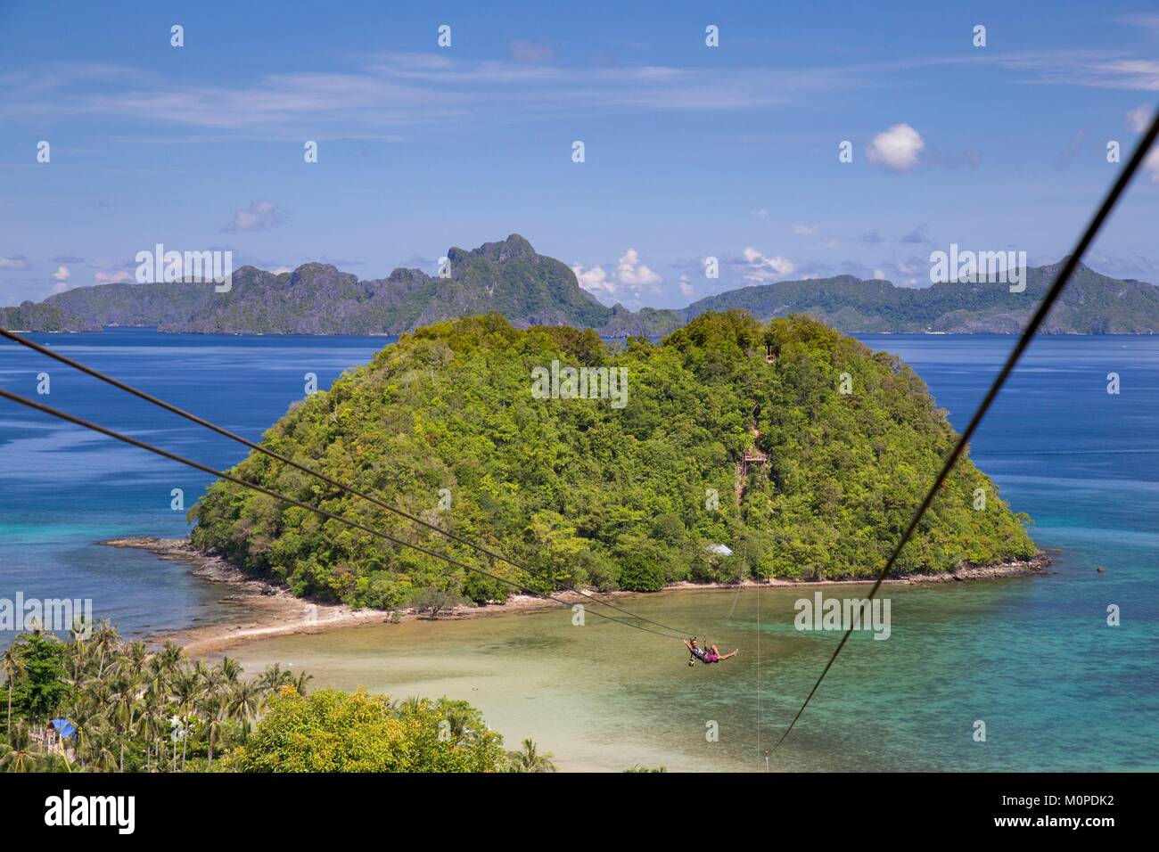 Philippines,Palawan,Las Cabañas beach,zipline over the sea joining ...