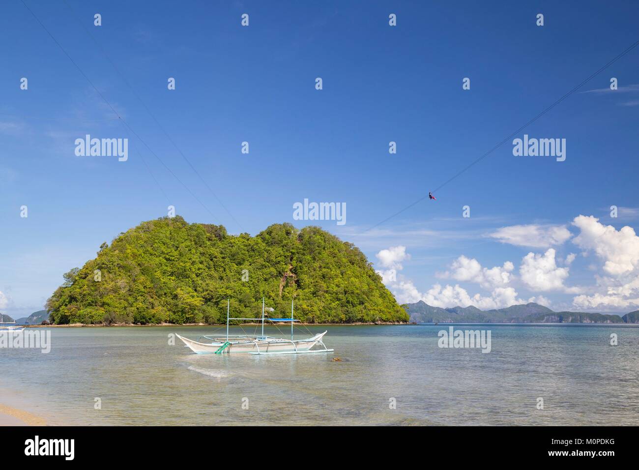 Philippines,Palawan,Las Cabañas beach,zipline over the sea joining ...
