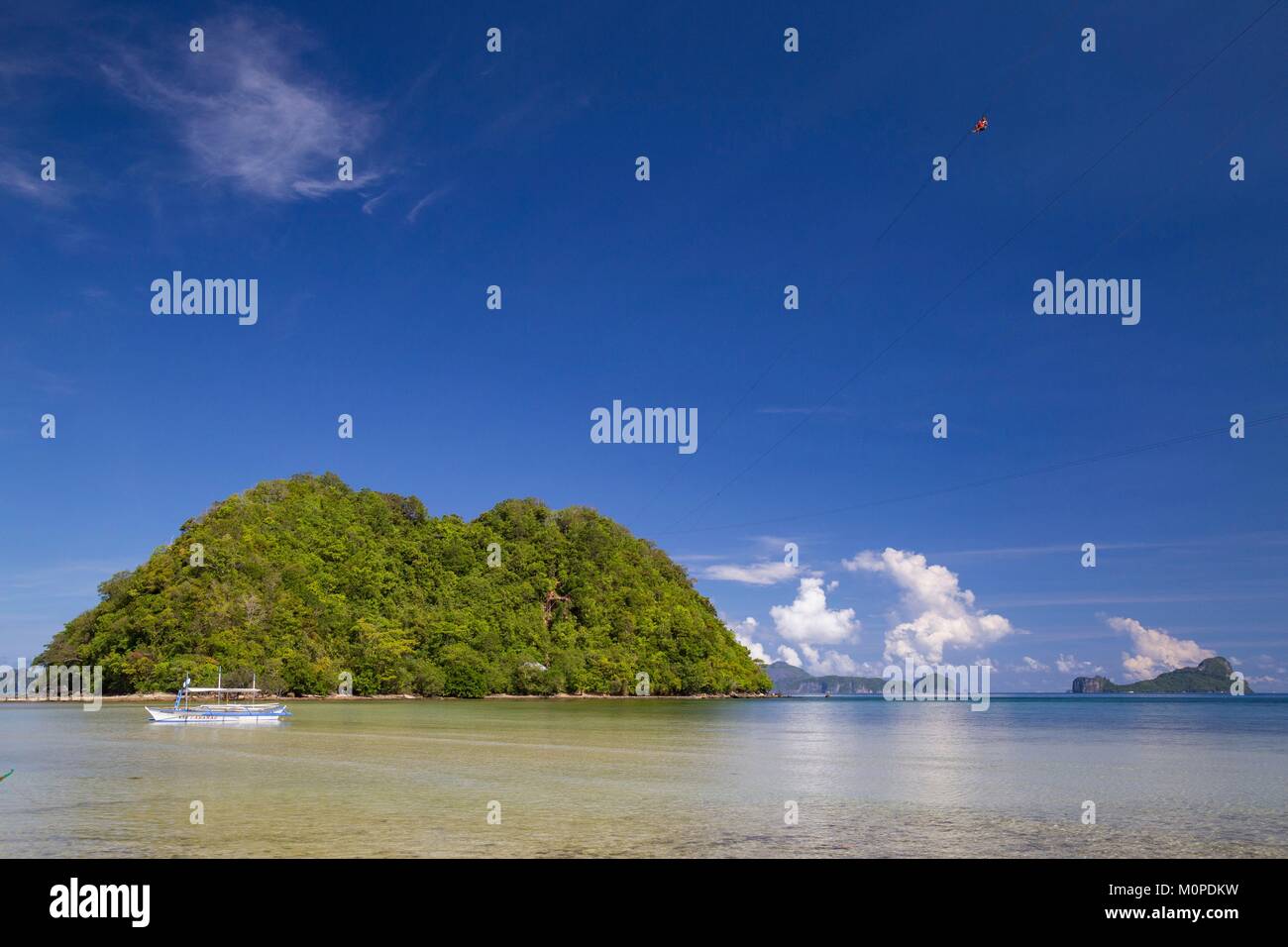 Philippines,Palawan,Las Cabañas beach,zipline over the sea joining ...