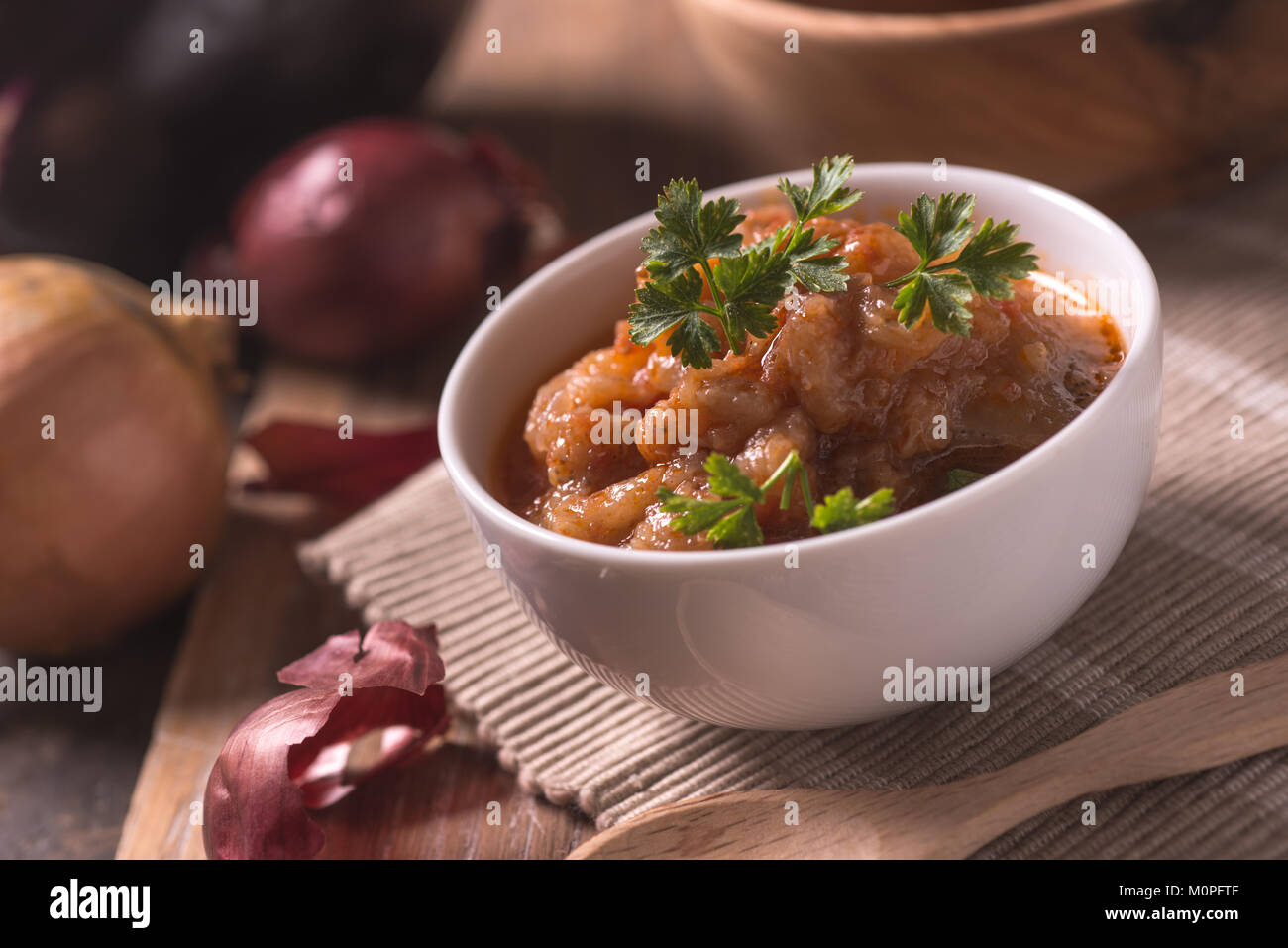 Baingan Bartha indian smoked eggplant dish on still life composition ...