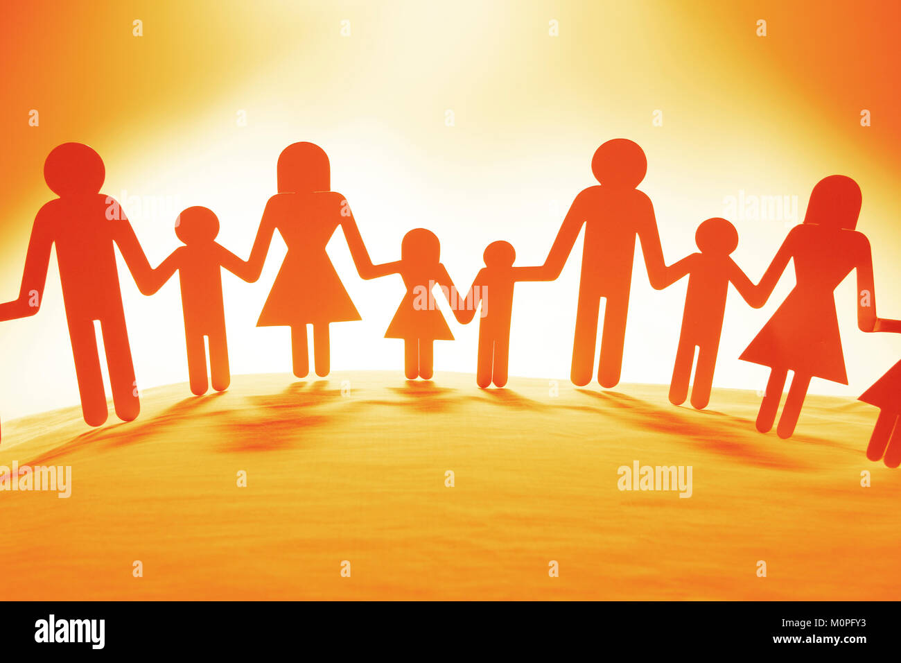 Family paper chain cutout holding hands Stock Photo - Alamy