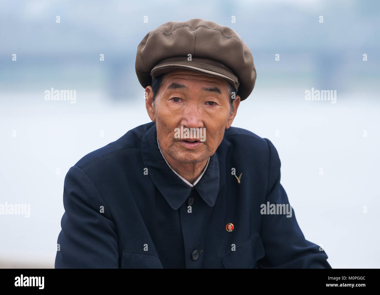 Portrait of senior North Korean man with a cap, Pyongan Province ...