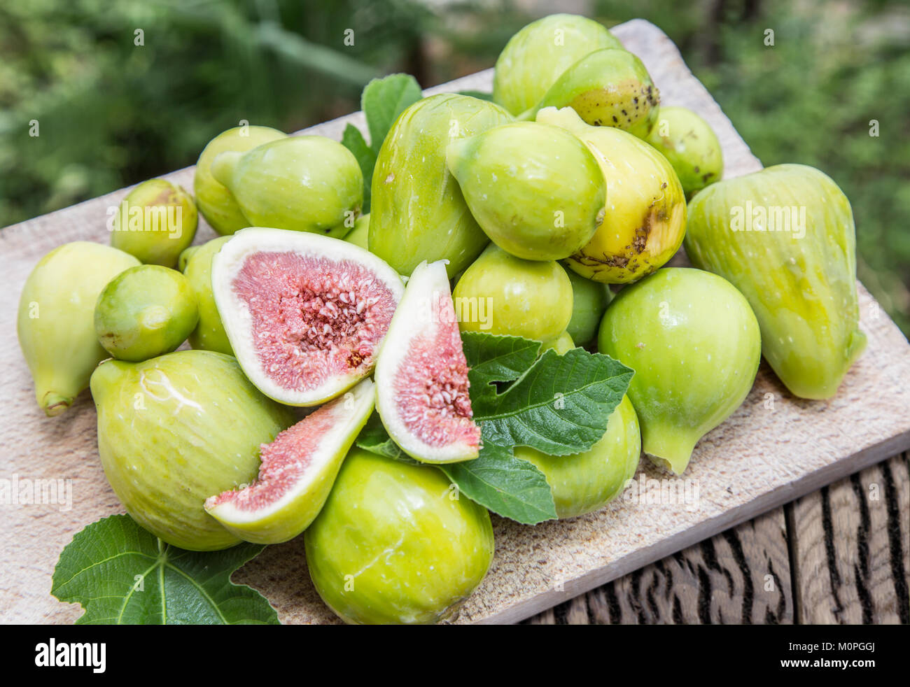 Ripe fig fruits on the wooden table Stock Photo - Alamy