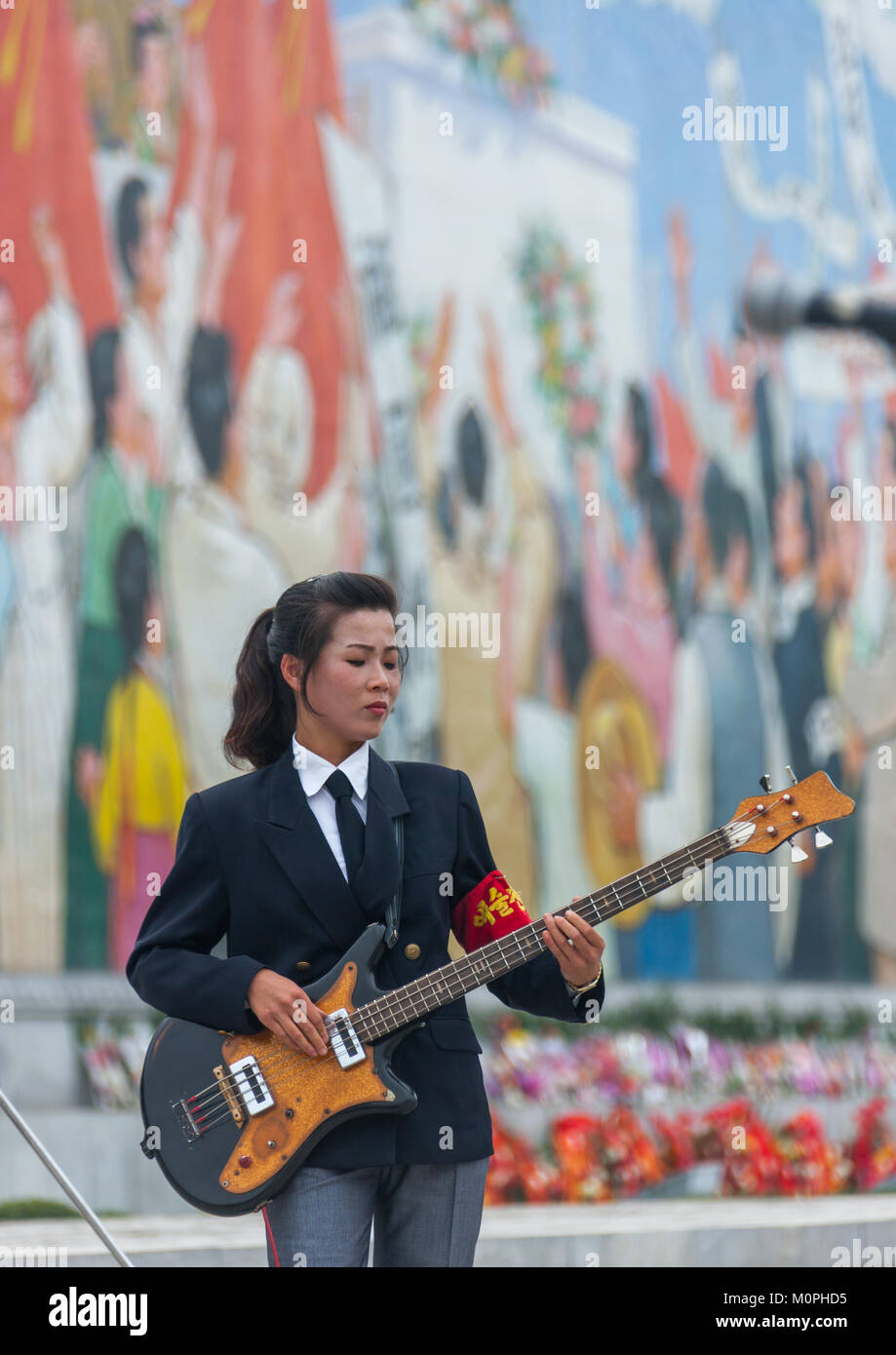 North Korean state artist playing bass on national day, Pyongan ...