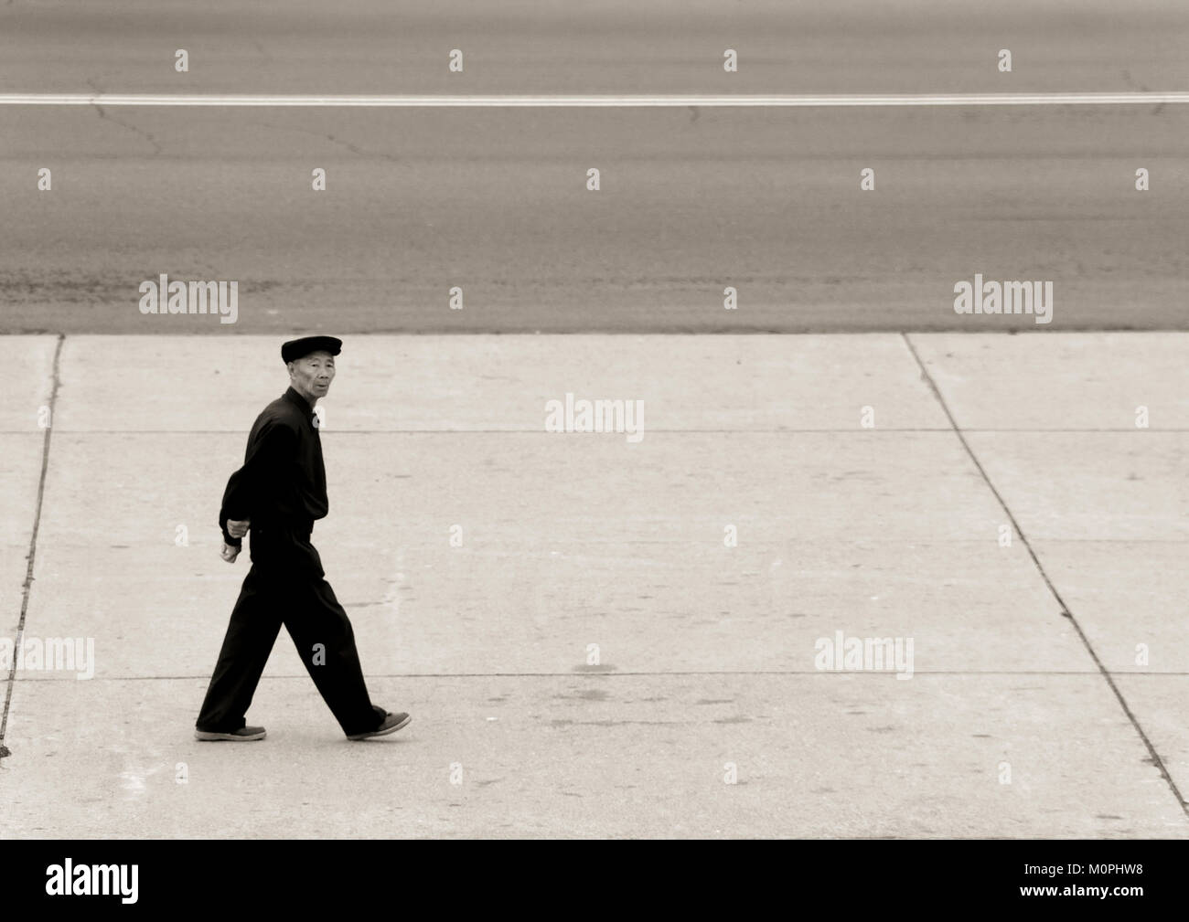 North Korean man walking in the street, Pyongan Province, Pyongyang ...