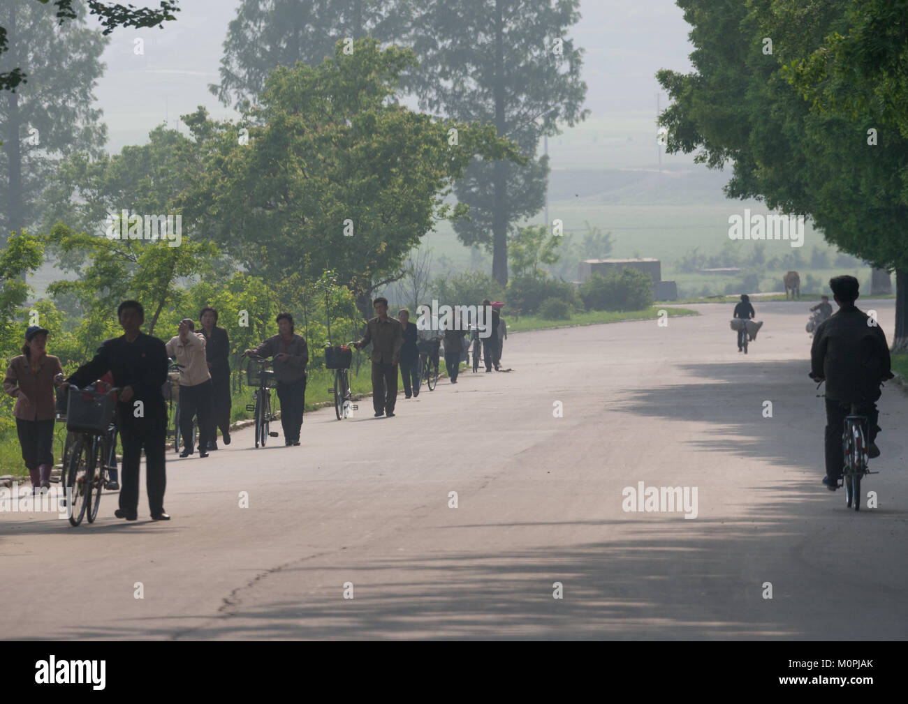 North Korean people along a rural road in the countryside, North ...