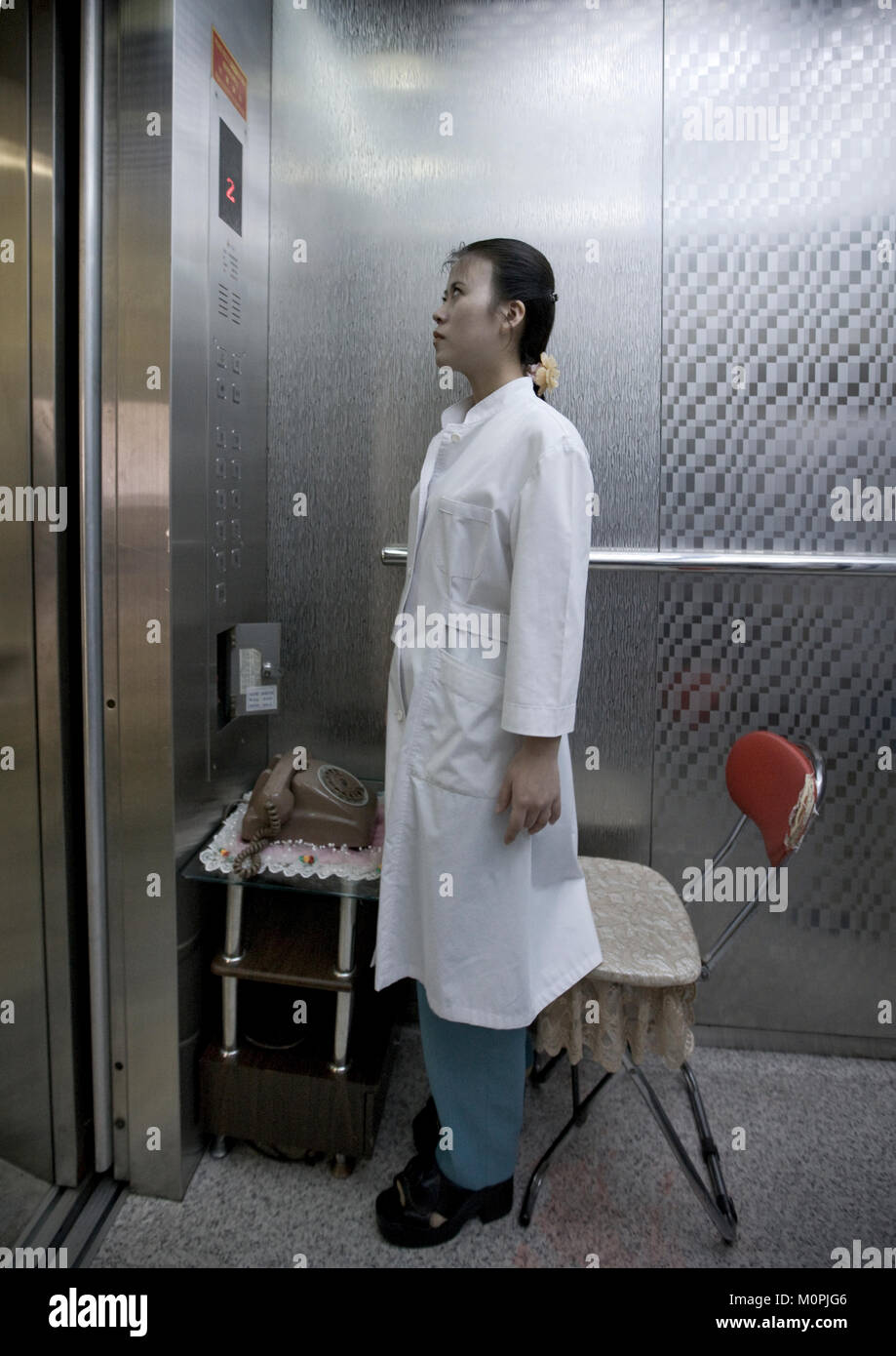 North Korean doctor in an elevator in a maternity, Pyongan Province ...