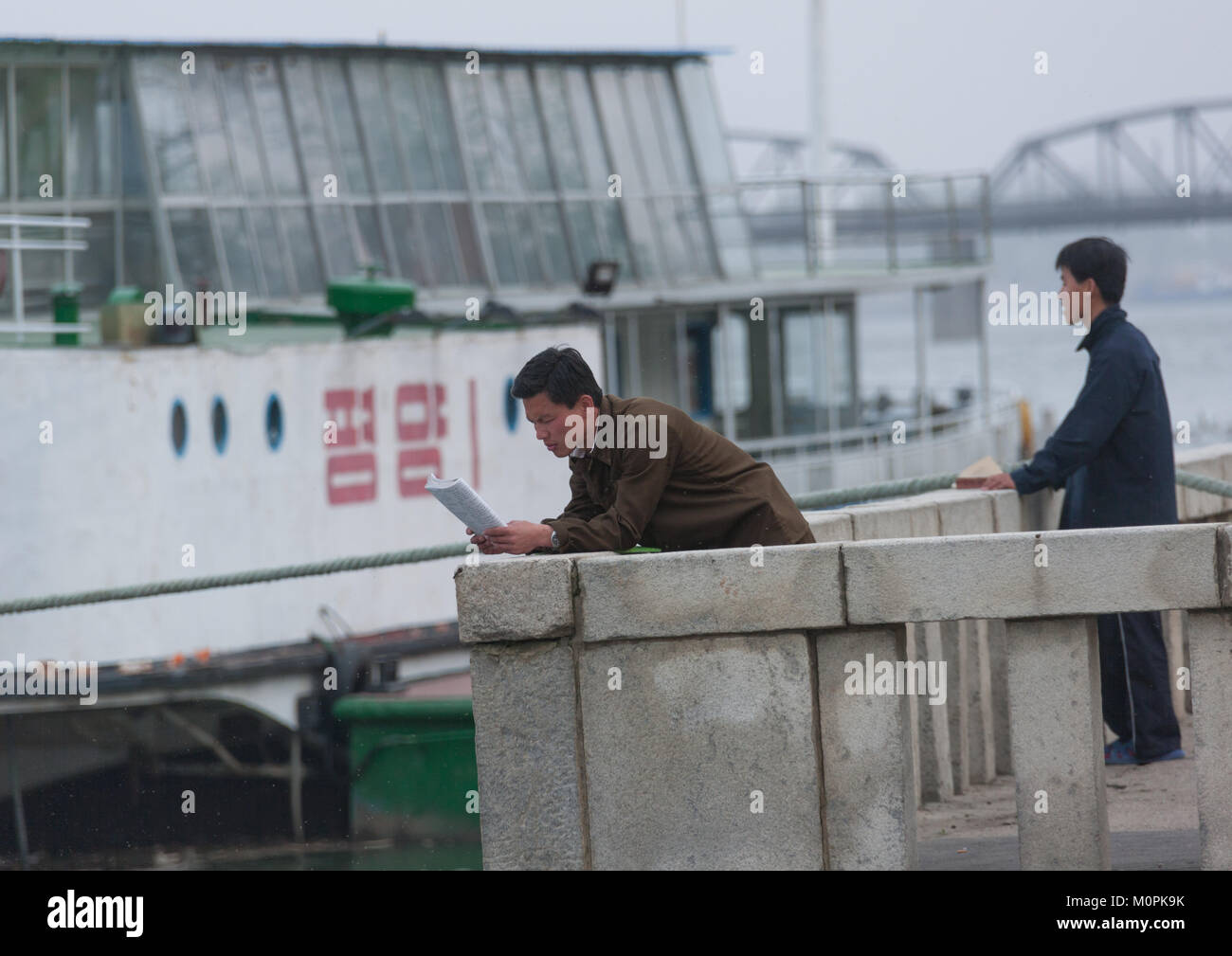 North korean man reading hi-res stock photography and images - Alamy