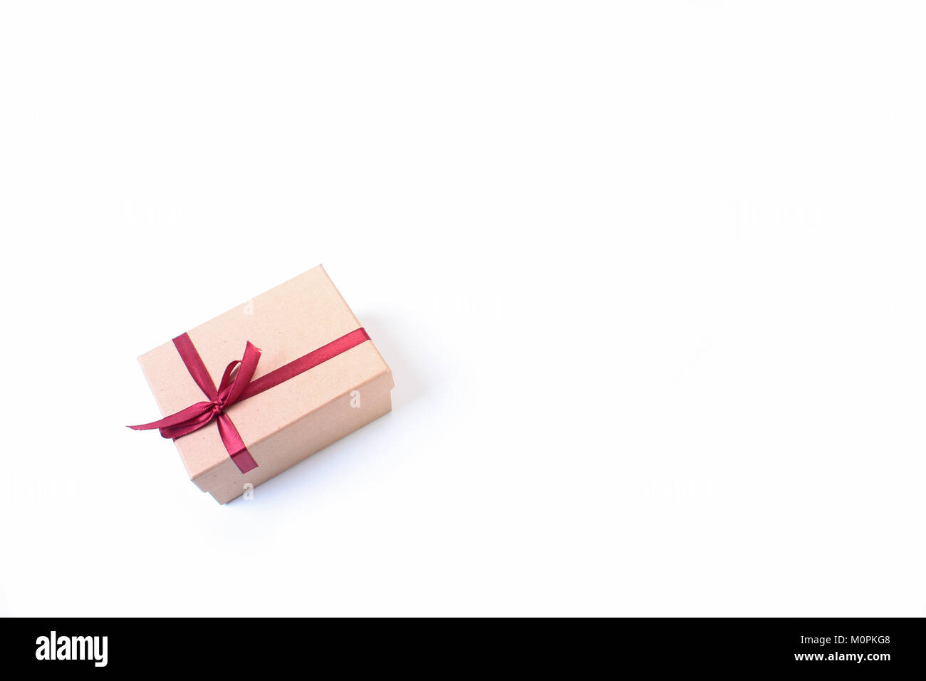 Gift boxes with bow on wood background Stock Photo - Alamy