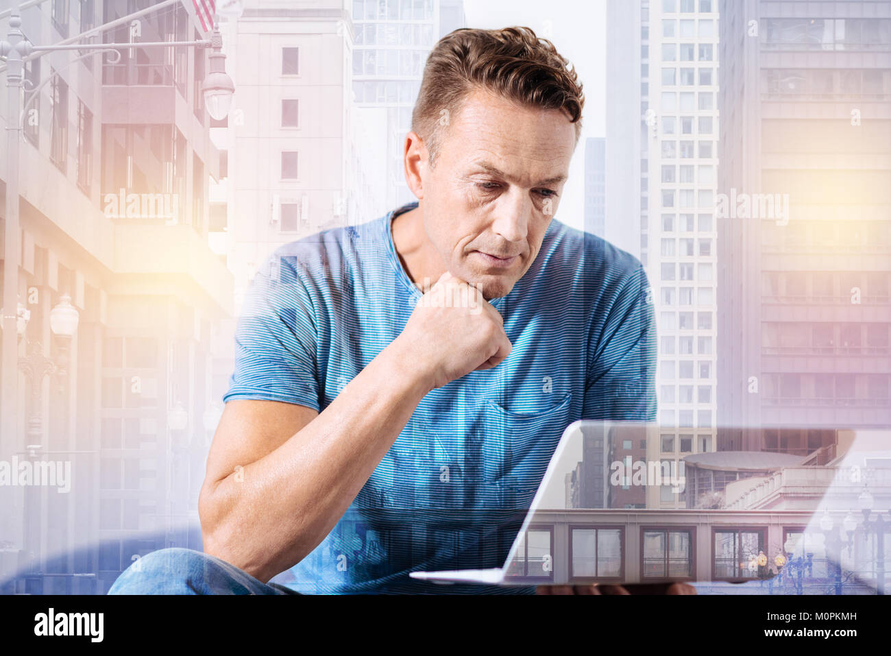 Serious male person being deep in thoughts Stock Photo - Alamy