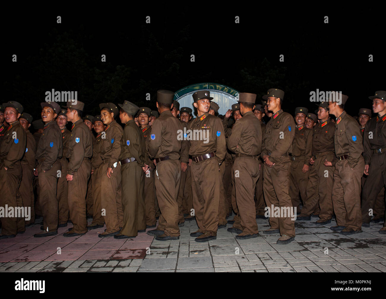 North Korean soldiers queueing for a fairground attraction at Kaeson ...