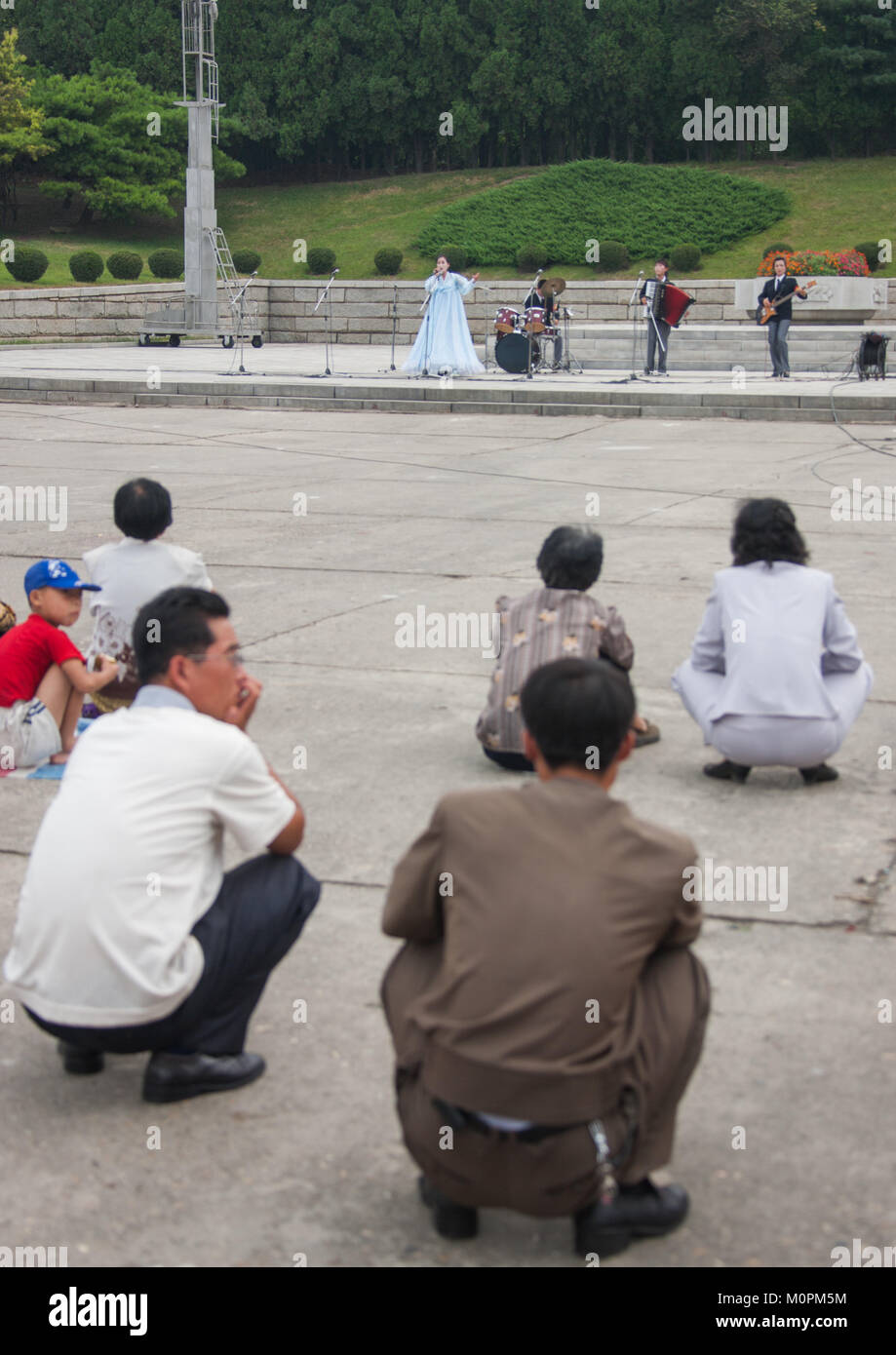 North Korean squatting to listen state artist performing on national ...