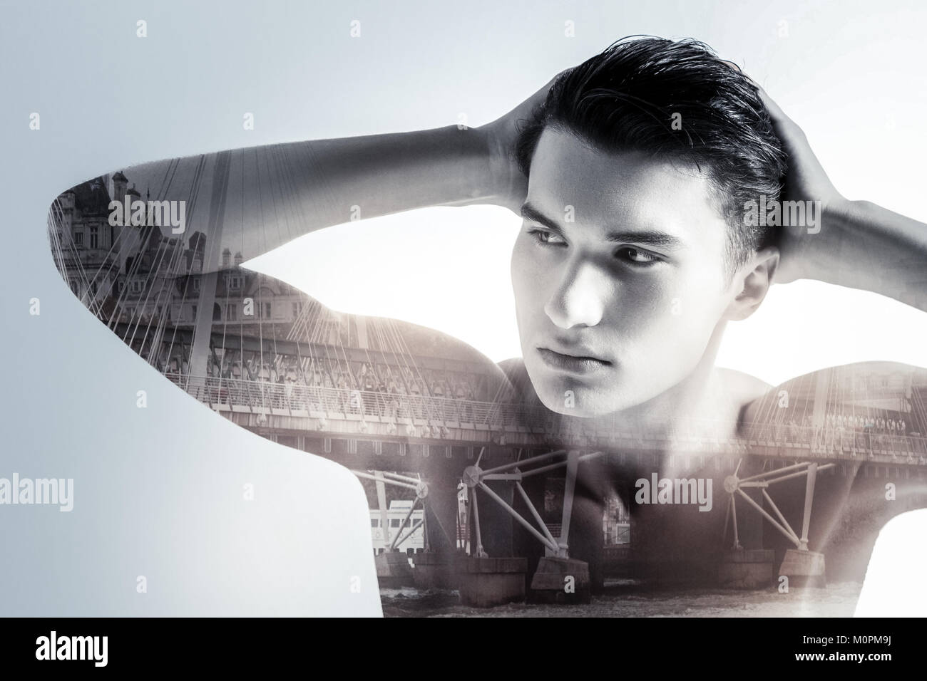 Concentrated handsome guy planning network Stock Photo - Alamy