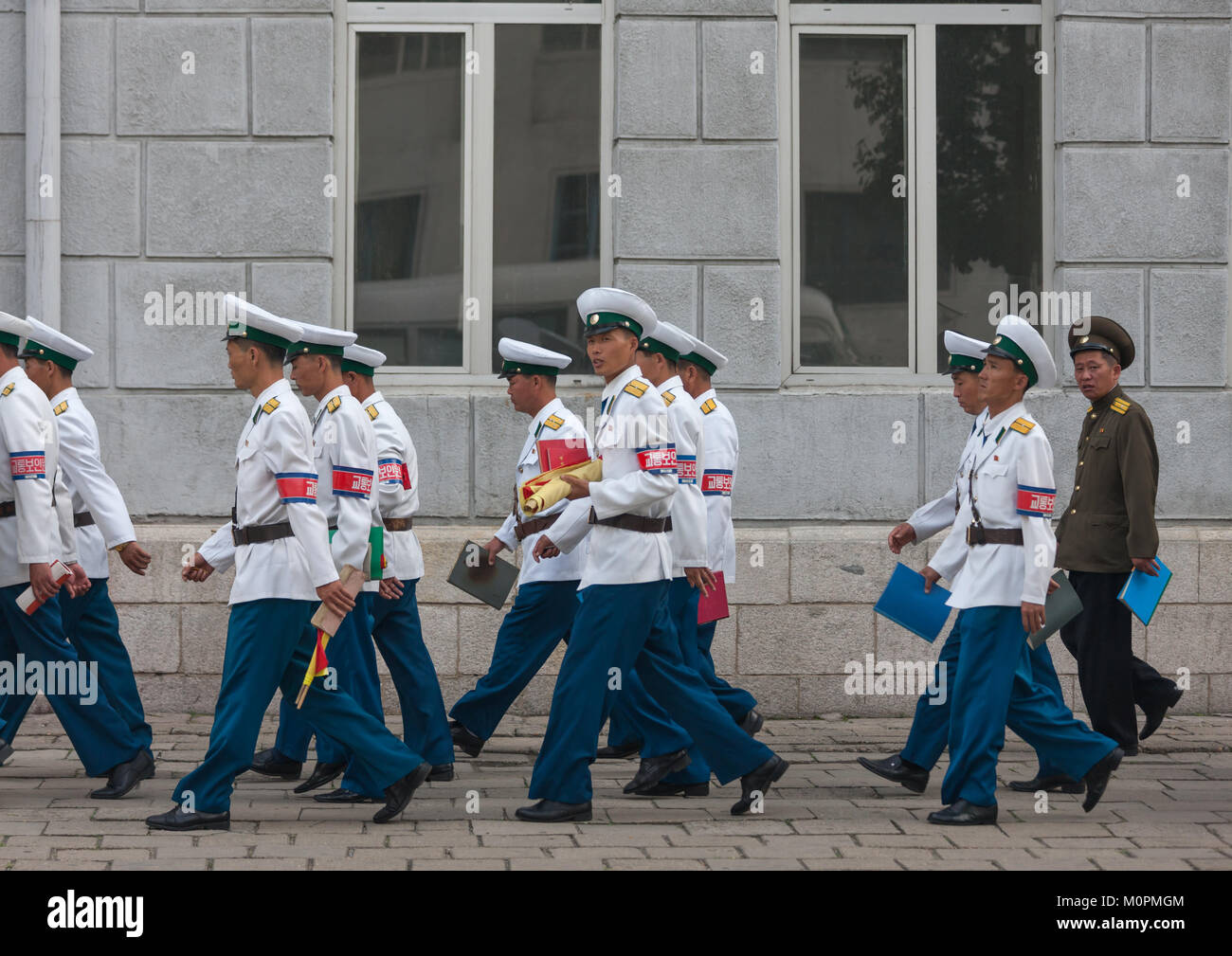 Group of North Korean male traffic security officers in white uniforms ...