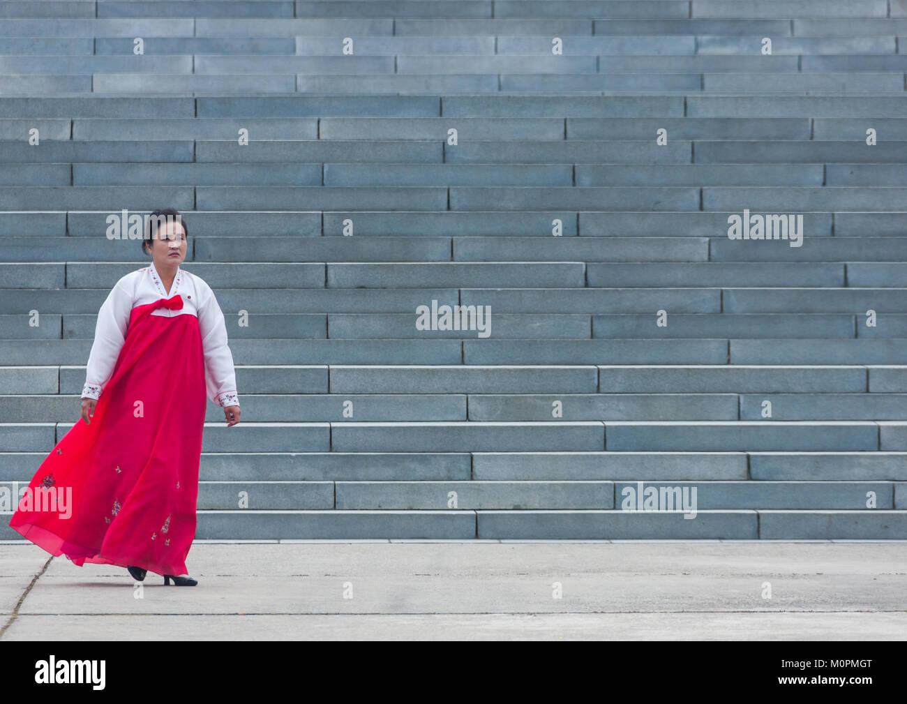 Portrait of a North Korean woman in traditional choson-ot in front of ...