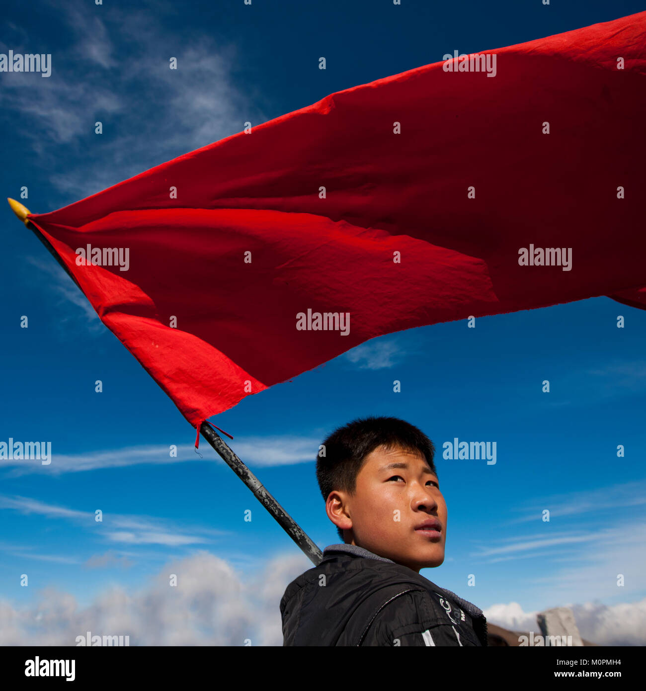 North Korean student with red flag in mount Paektu, Ryanggang Province ...