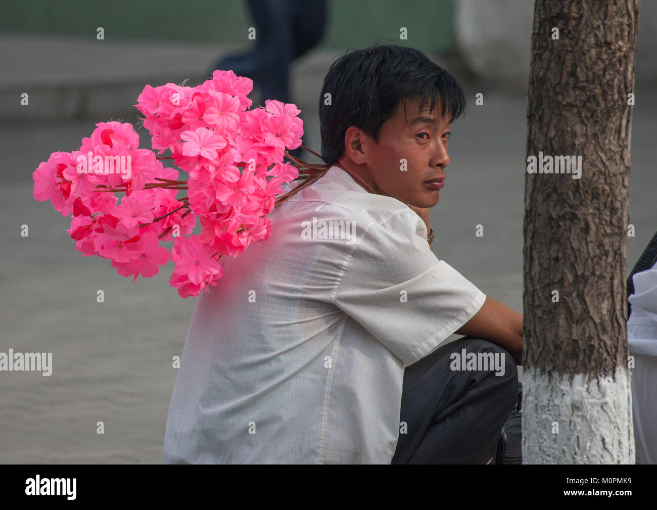 North Korean man going to the celebration of the 60th anniversary of ...