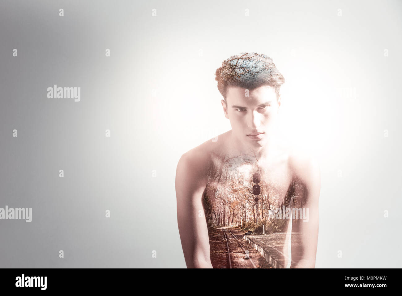 Depressed pretty guy tired from life Stock Photo - Alamy