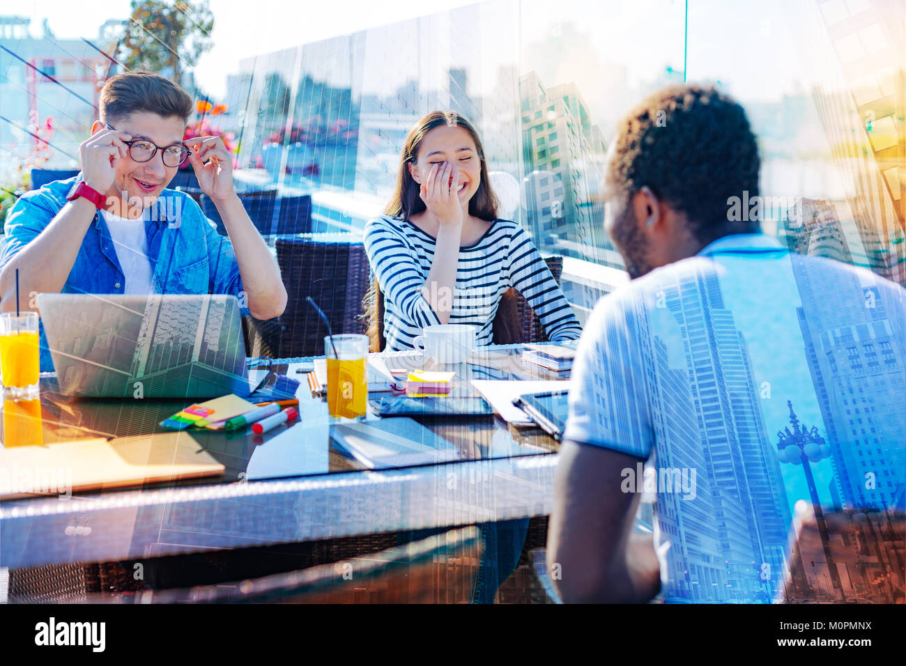 Optimistic students having brilliant time together Stock Photo - Alamy
