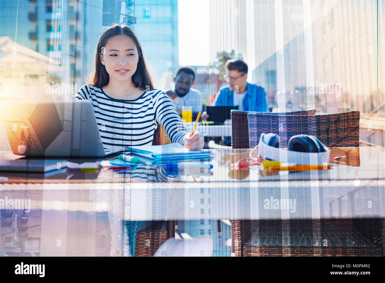 Thoughtful student preparing for seminars Stock Photo - Alamy
